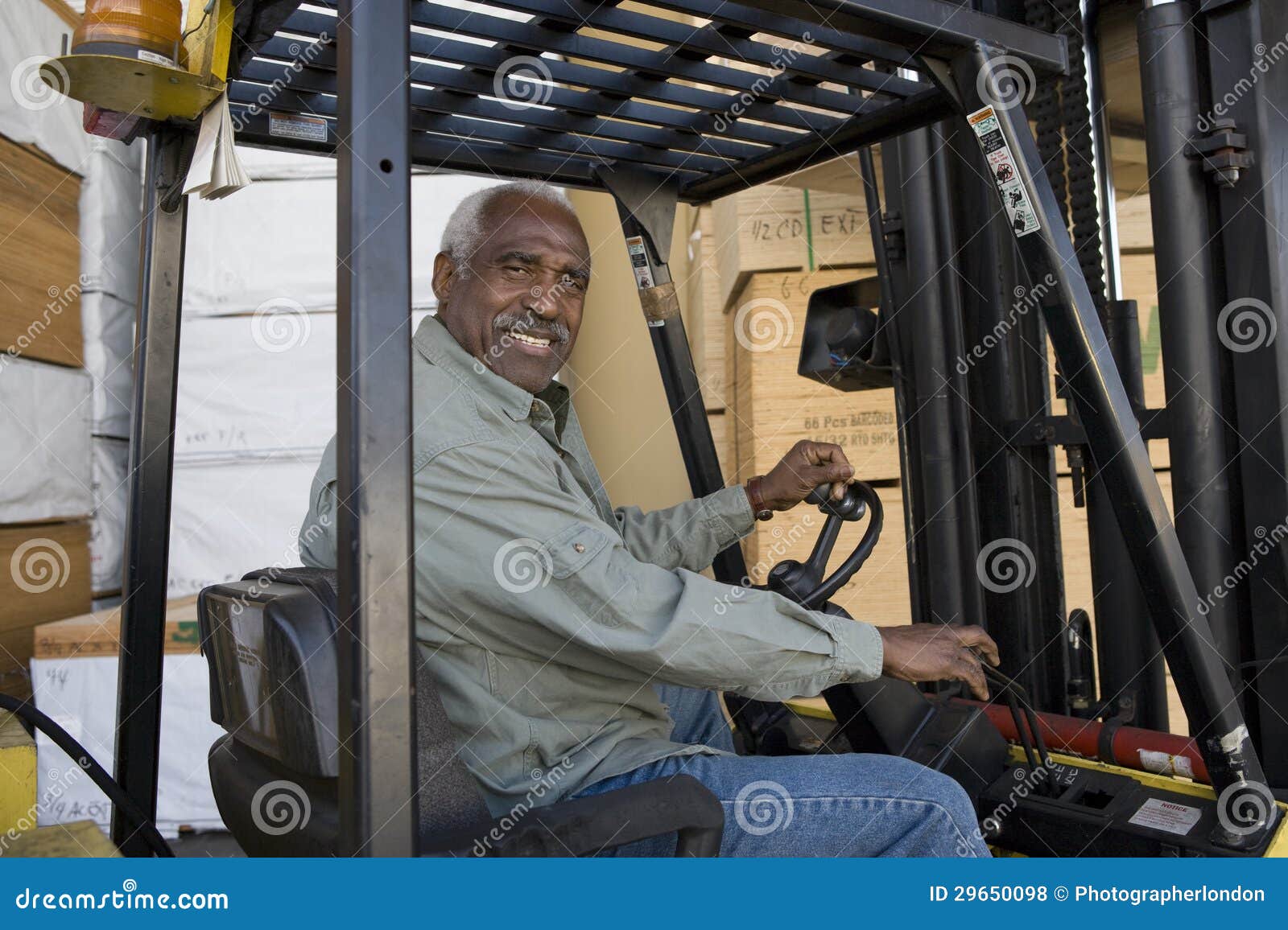 Senior Warehouse Worker Driving Forklift Stock Photo - Image of ...