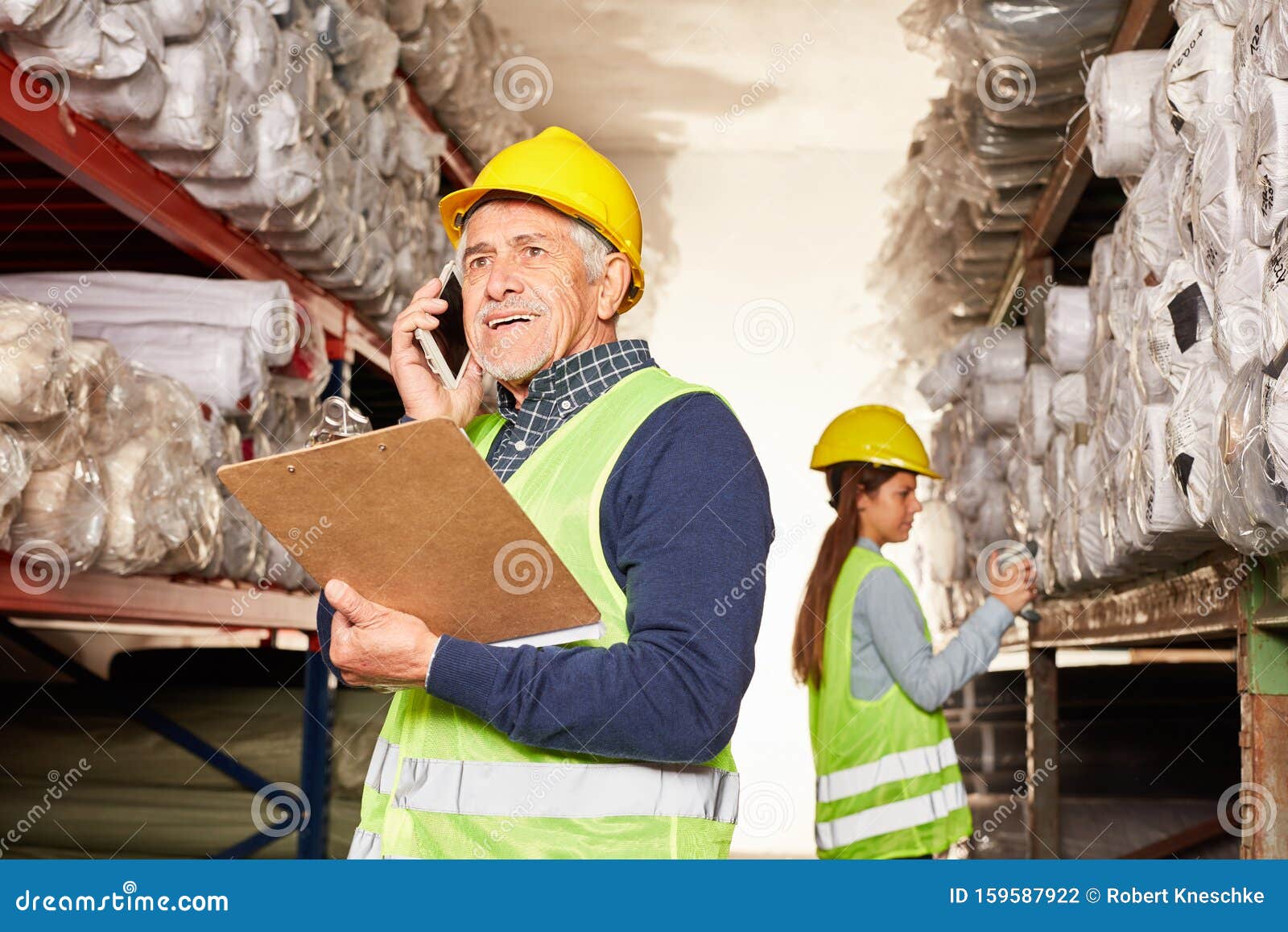 Senior Warehouse Worker Telephoned in the Warehouse Stock Photo - Image ...