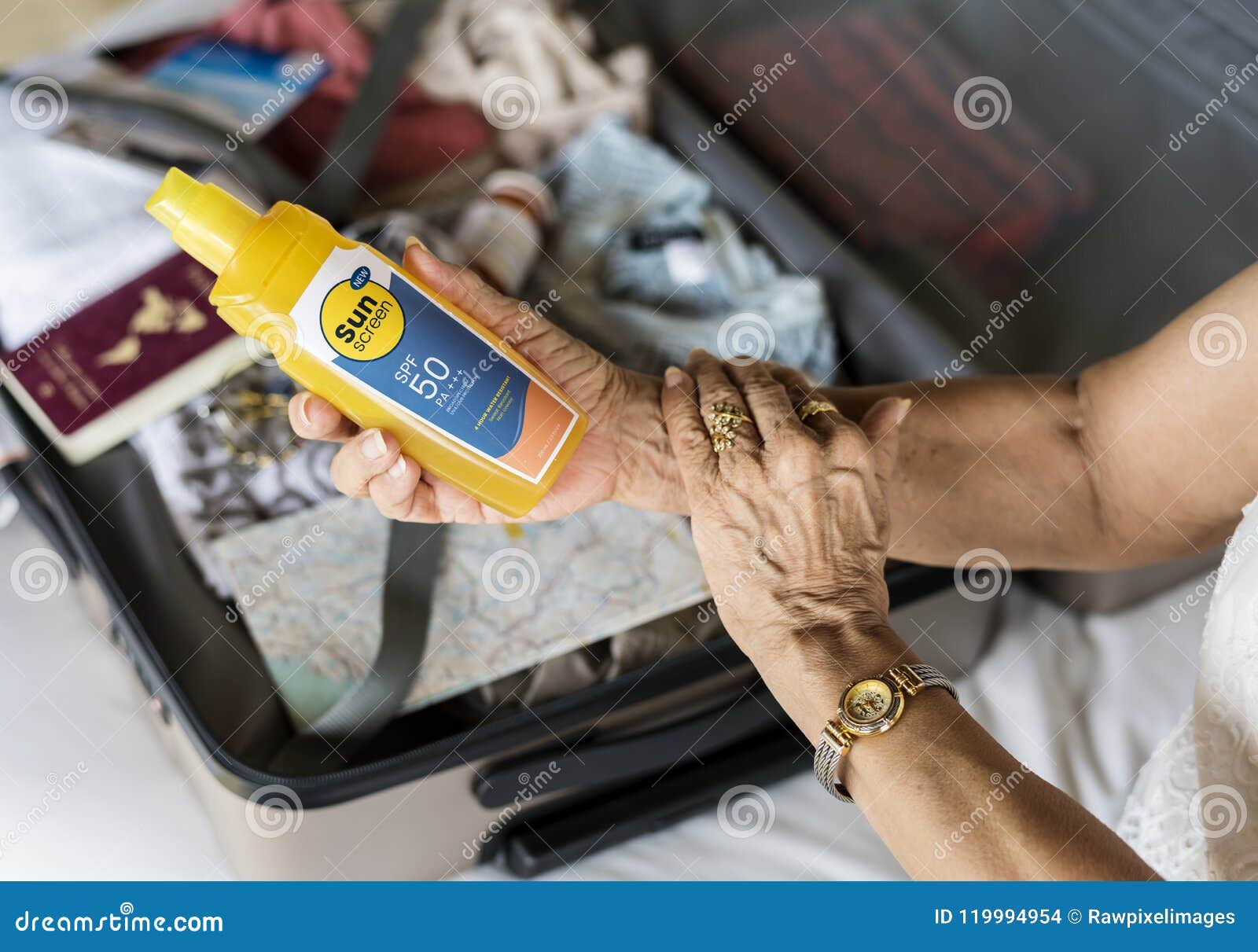 Senior Woman Applying Sunscreen on Her Arm Stock Photo - Image of ...