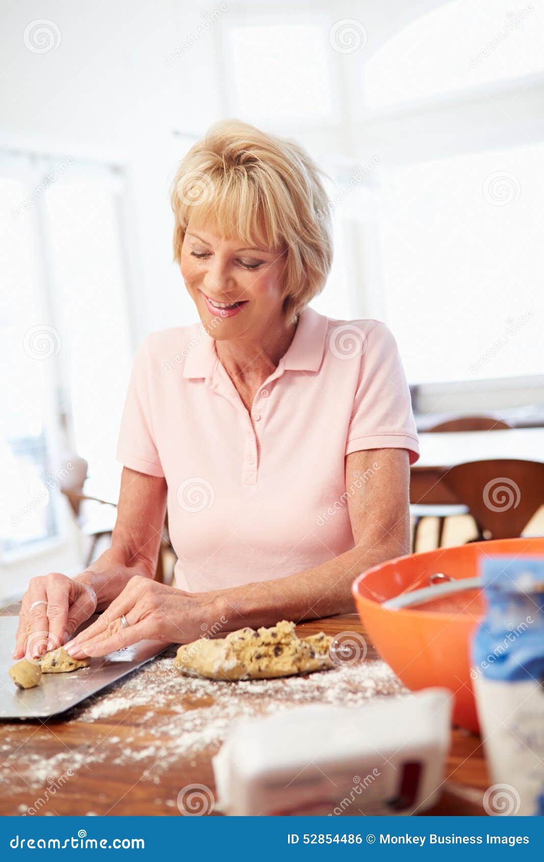 Senior Woman Baking Cookies in Kitchen Stock Photo - Image of ...