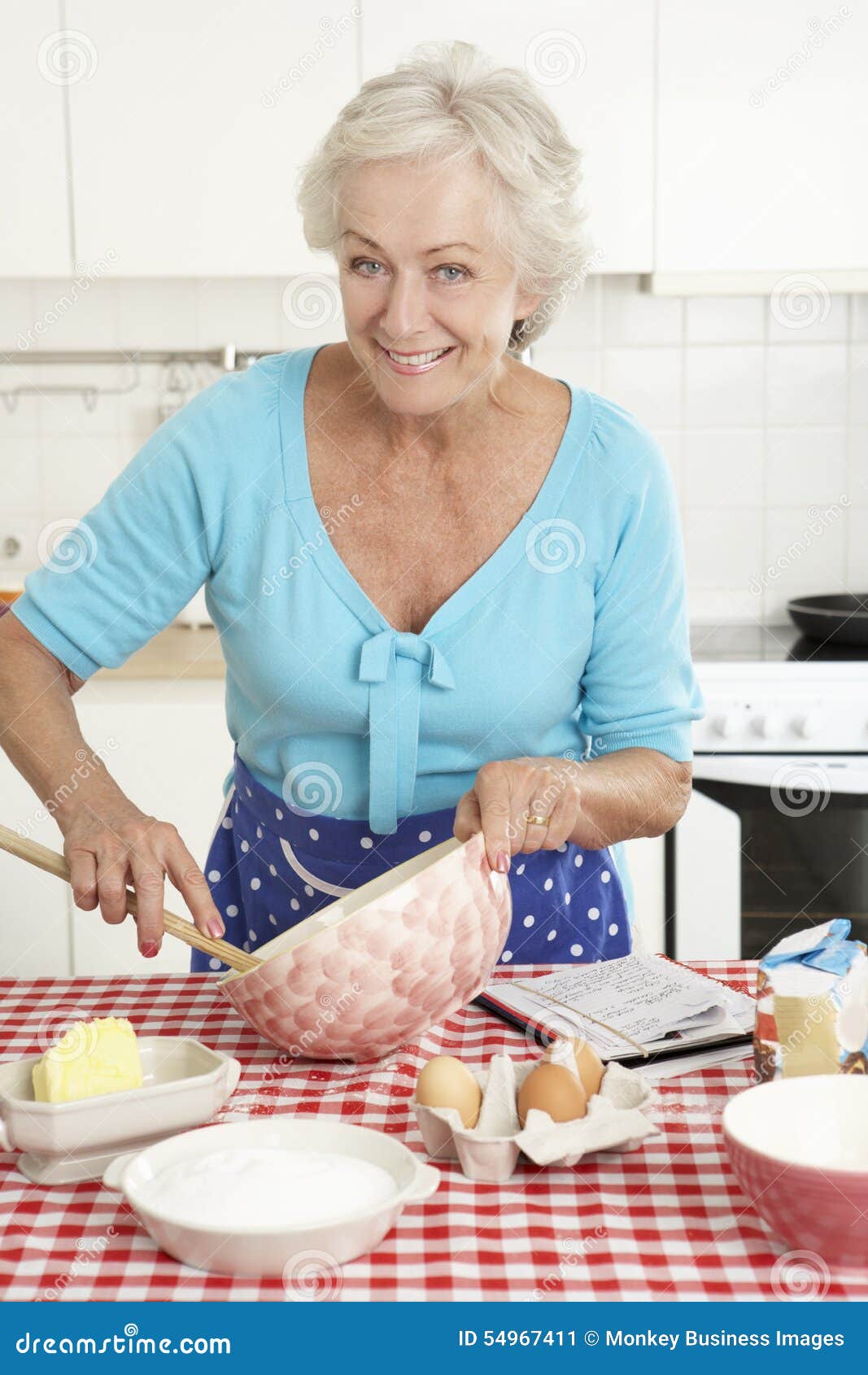 Senior Woman Baking in Kitchen Stock Image - Image of senior, person ...