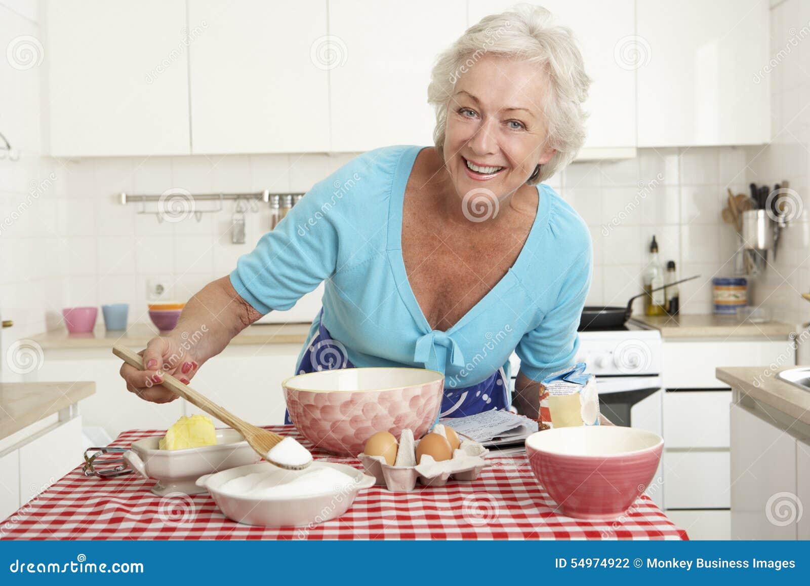 Senior Woman Baking in Kitchen Stock Photo - Image of butter, apron ...