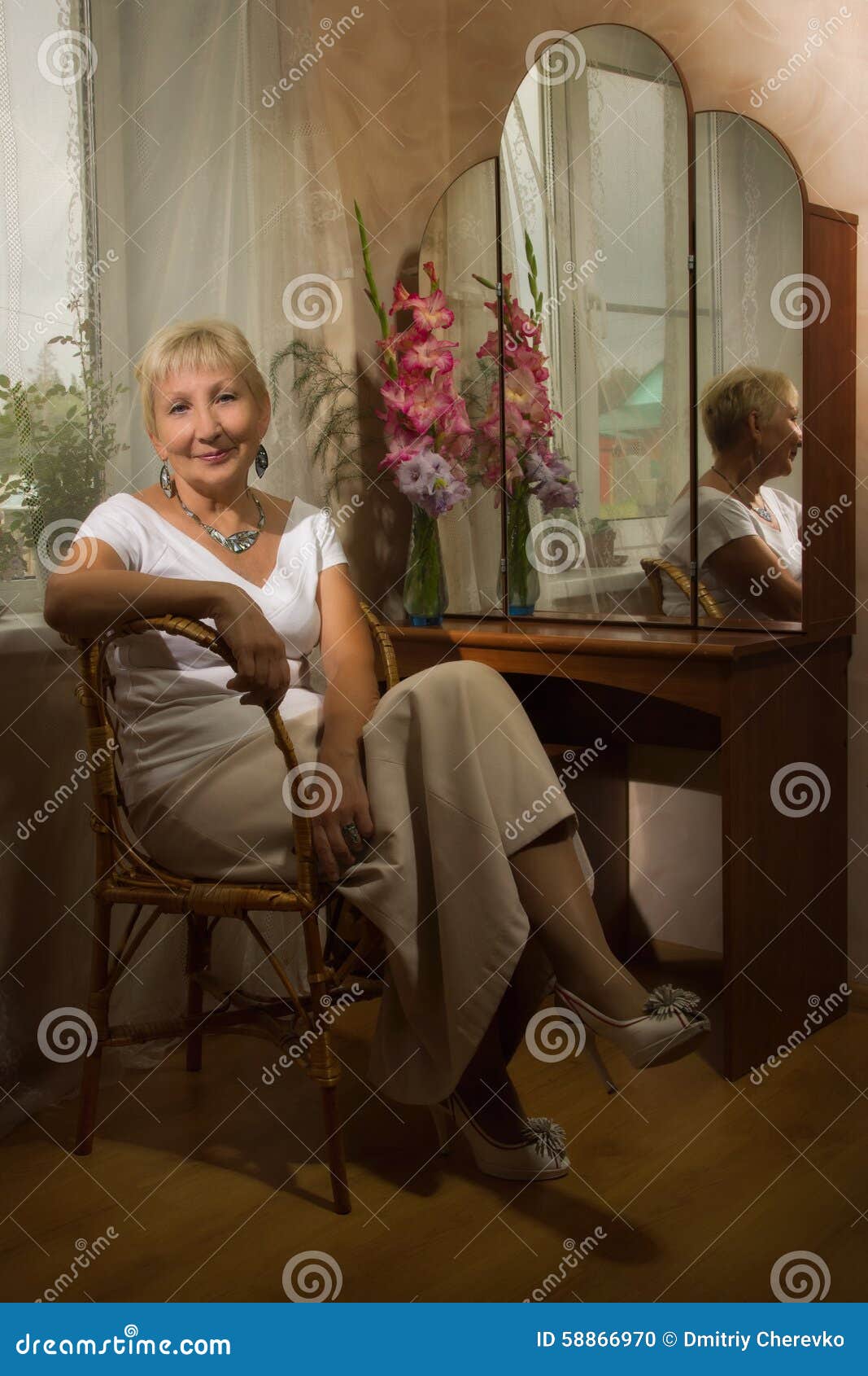 Senior woman in a boudoir stock photo. Image of portrait - 58866970