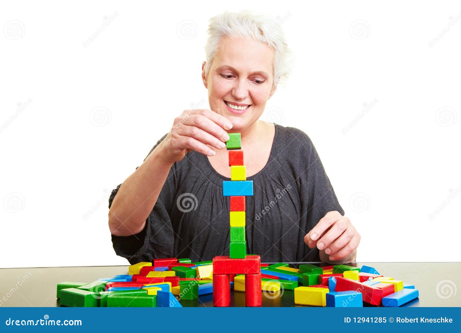 Senior Woman Building with Colorful Stock Image - Image of block ...