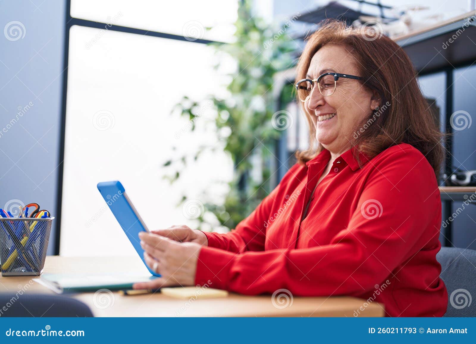 Senior Woman Business Worker Using Touchpad Working at Office Stock ...