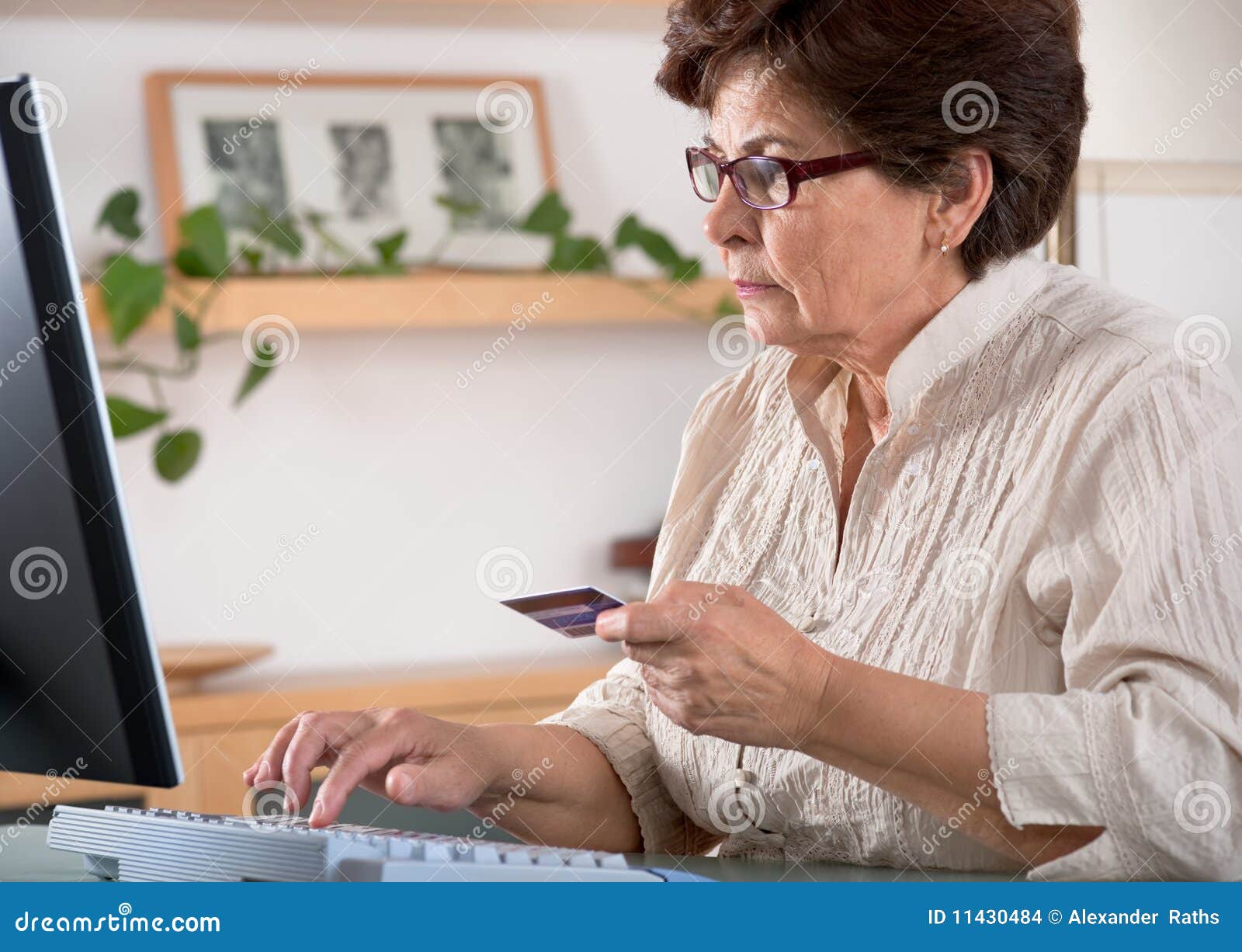 Senior woman on computer stock photo. Image of female - 11430484