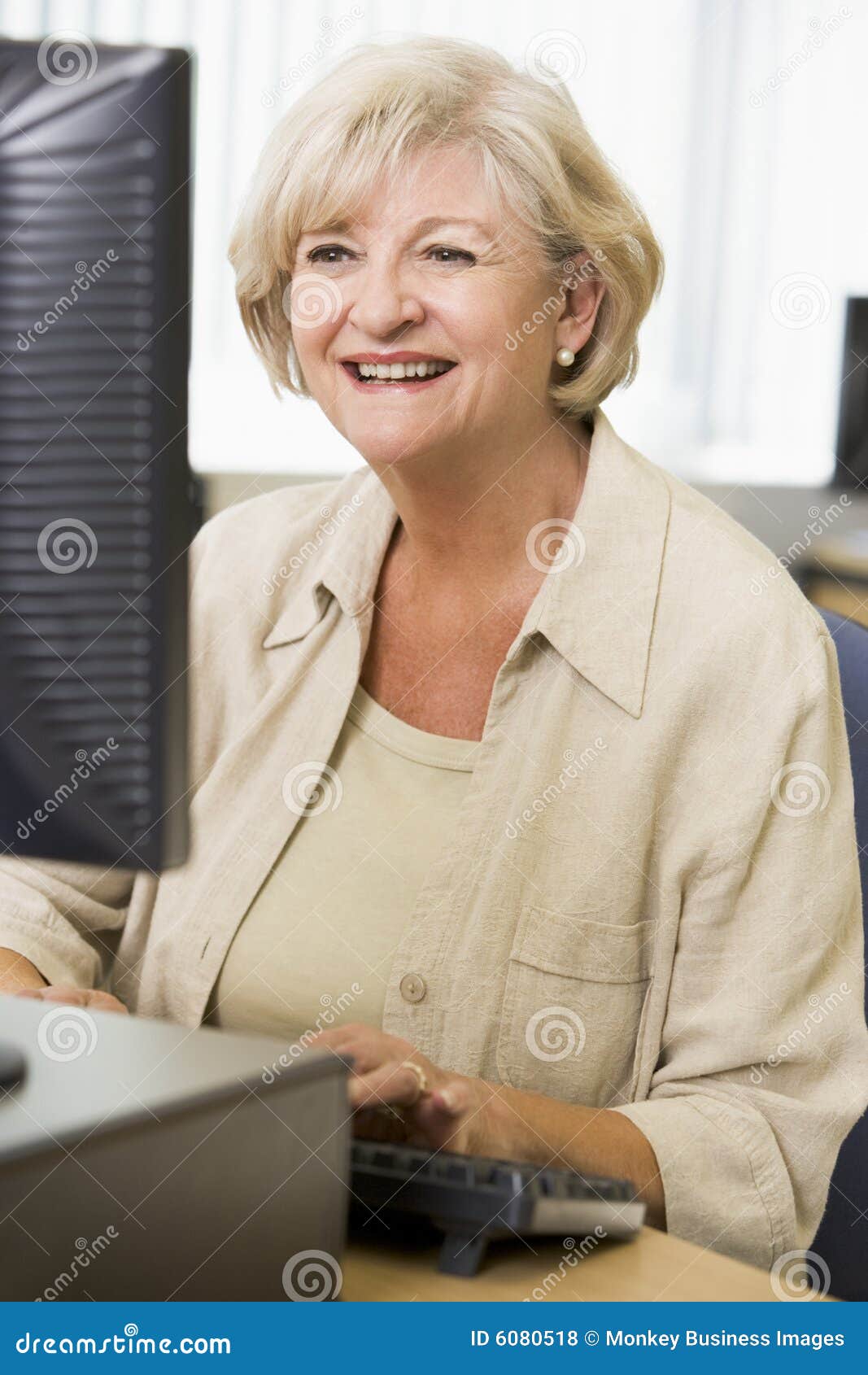 Senior woman on a computer stock photo. Image of information - 6080518
