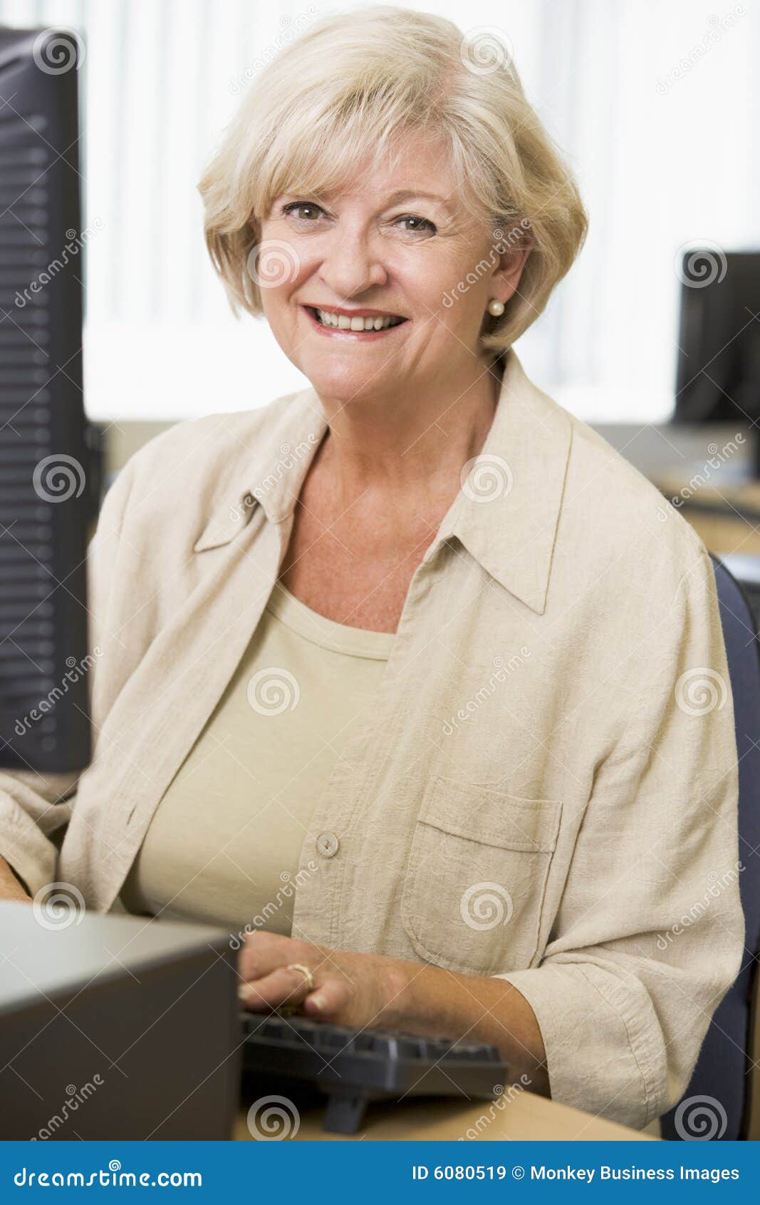 Senior woman on a computer stock image. Image of seventies - 6080519