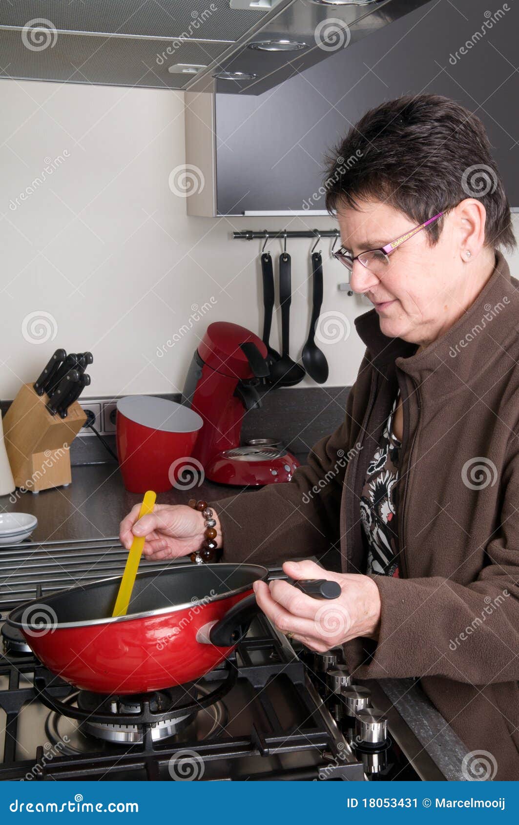 Senior woman cooking stock image. Image of steel, senior - 18053431