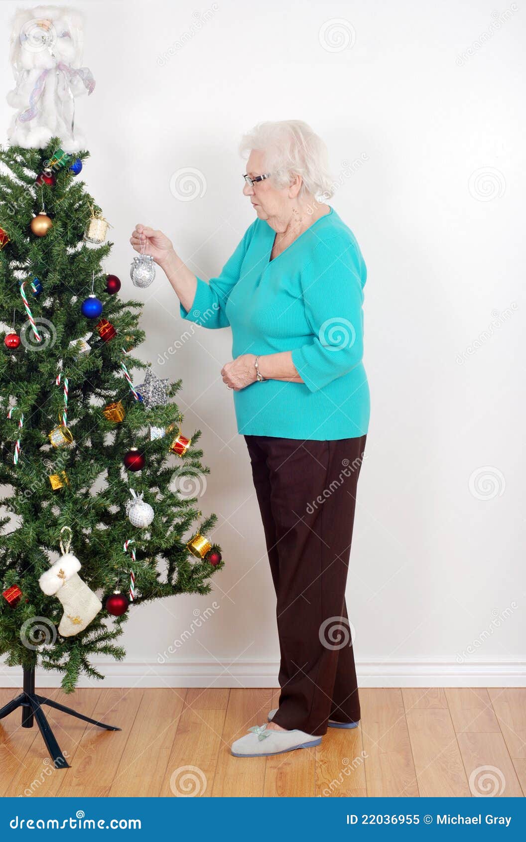 Senior Woman Decorating Her Christmas Tree Stock Image - Image of blue ...