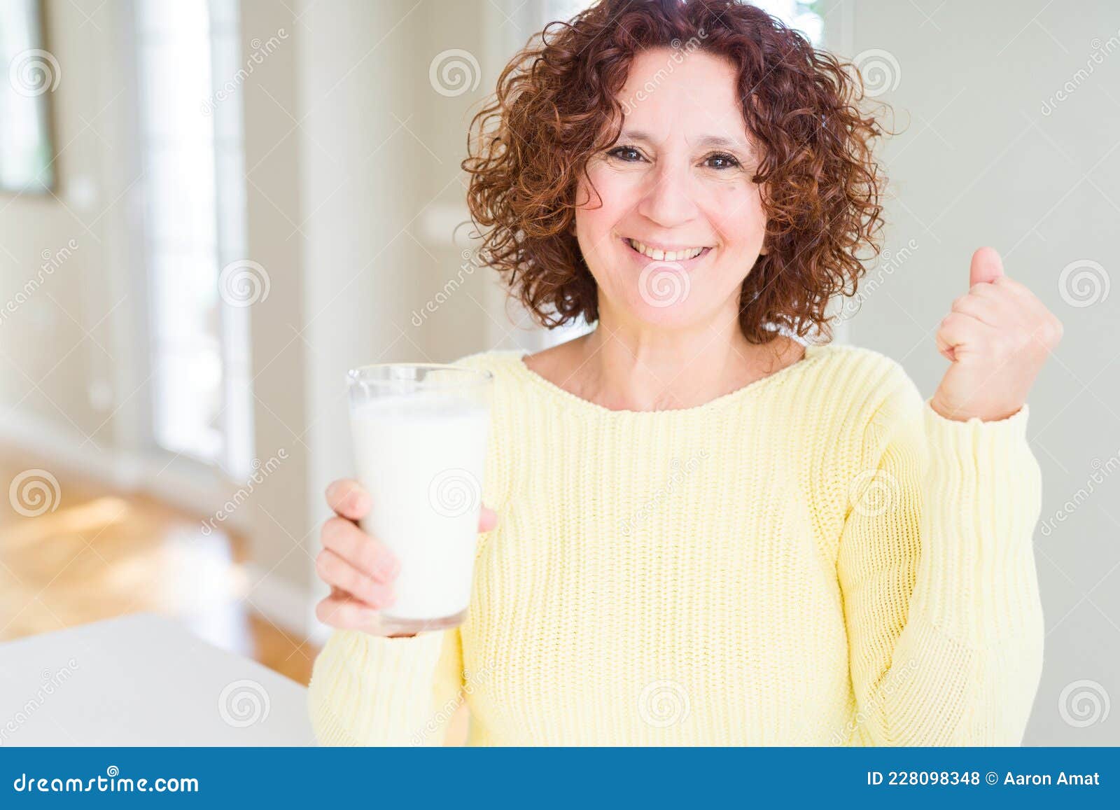 Senior Woman Drinking A Glass Of Fresh Milk Screaming Proud And