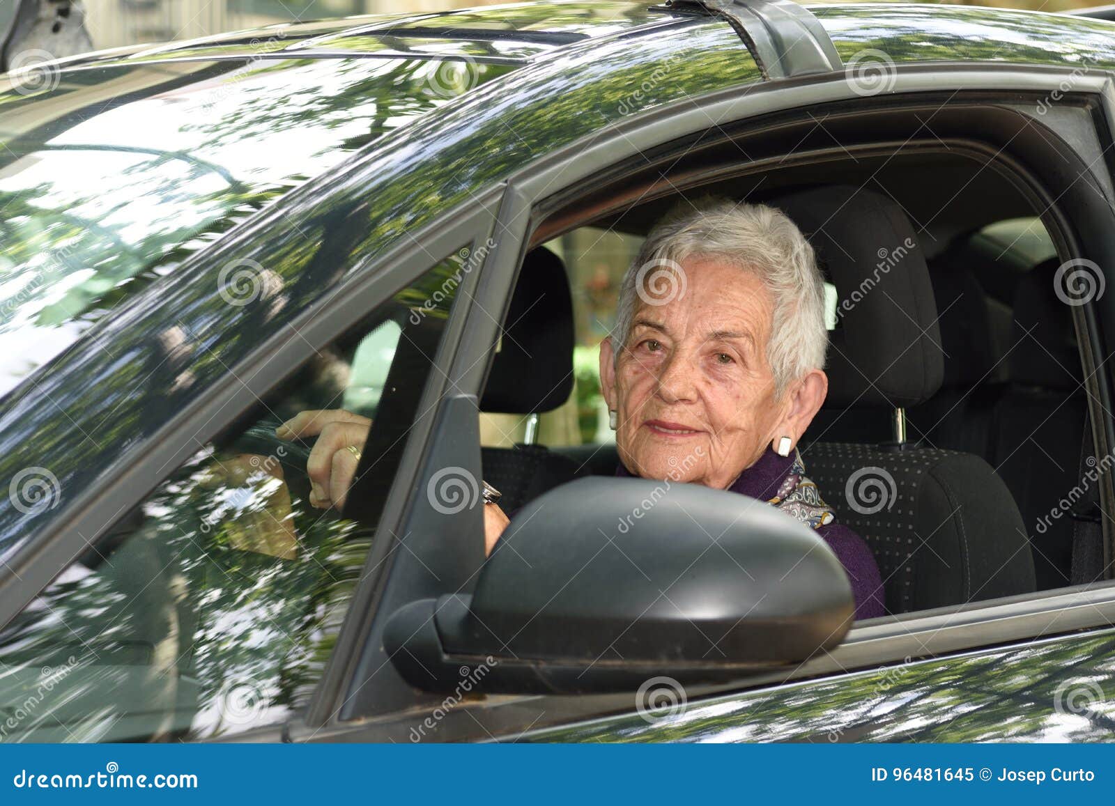 Senior woman driving a car stock image. Image of healthy - 96481645