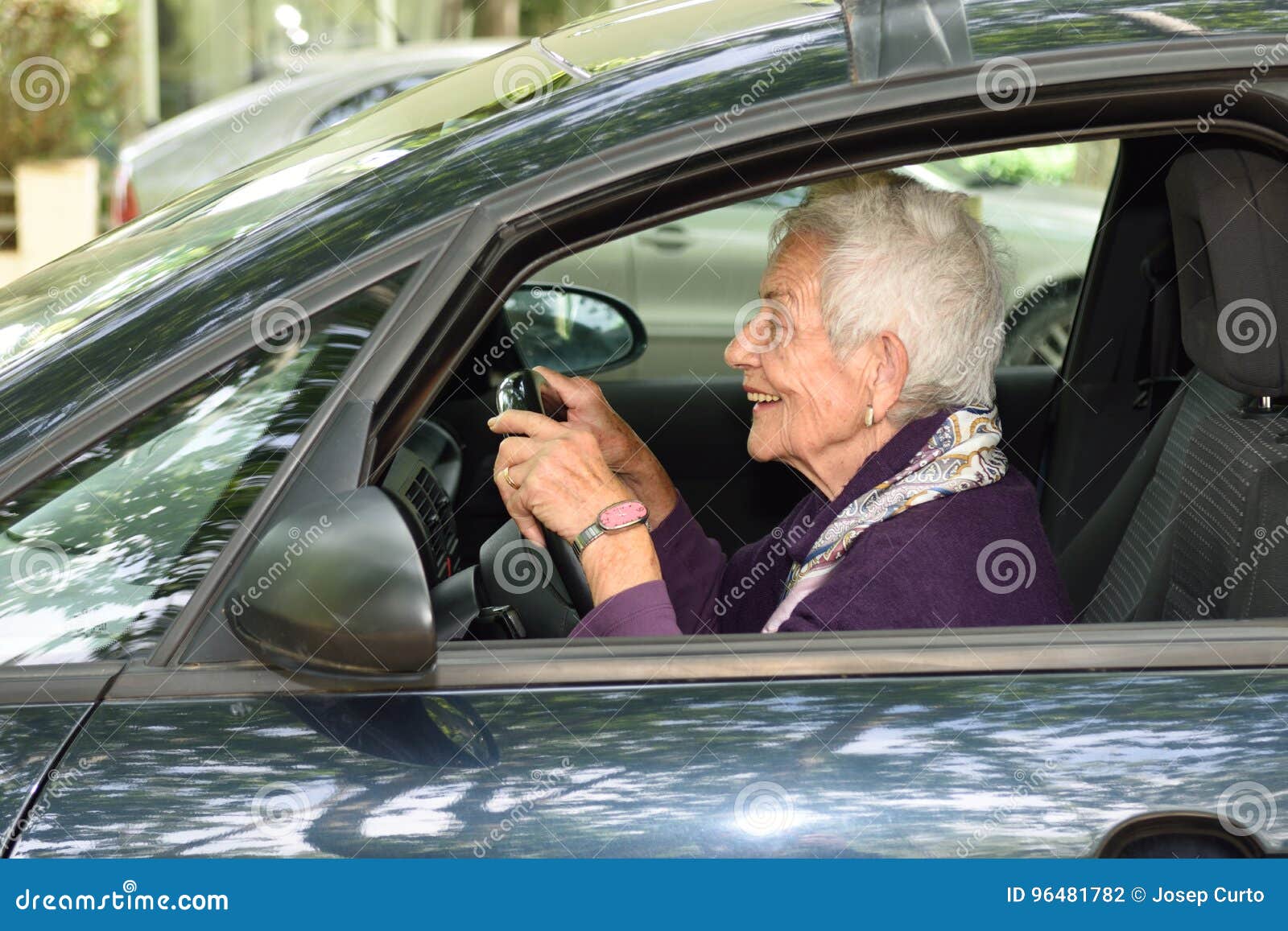 Senior woman driving a car stock photo. Image of older - 96481782