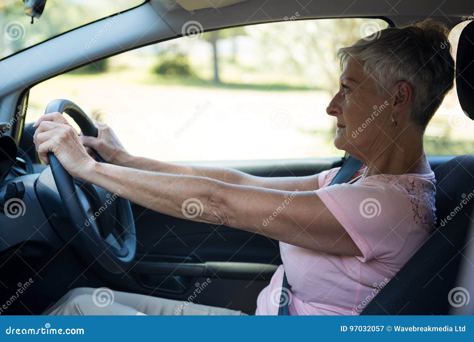 Senior woman driving a car stock image. Image of retired - 97032057