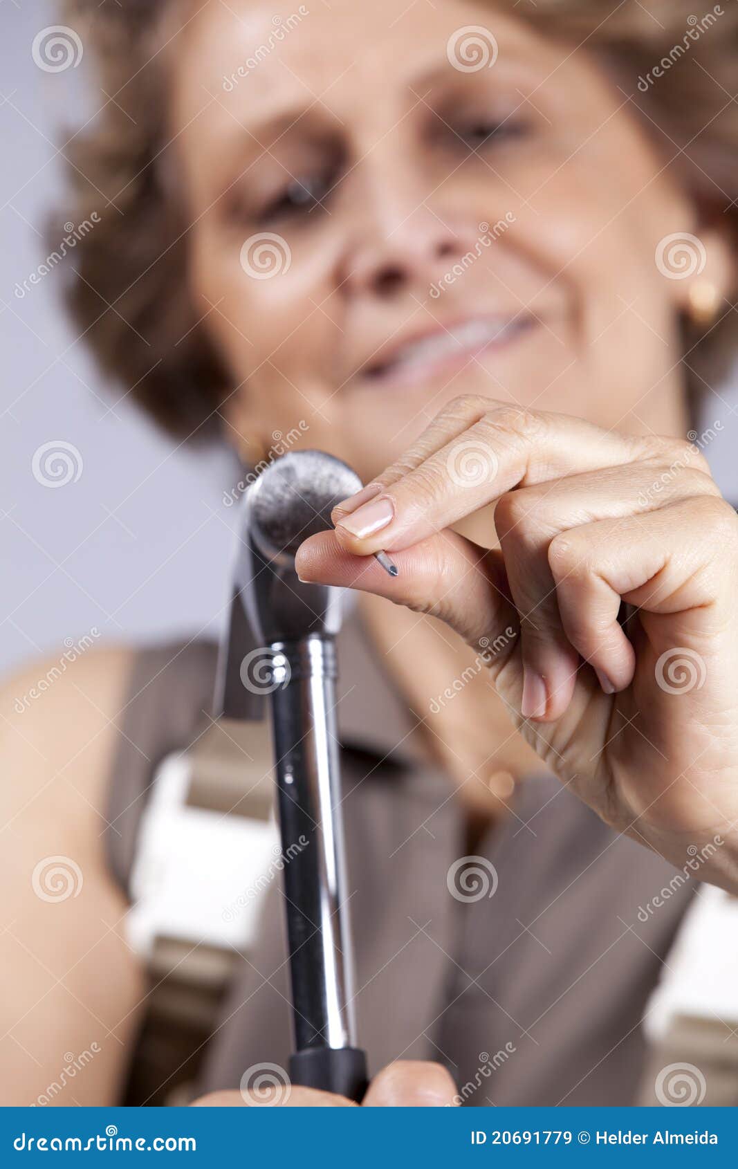 Senior Woman Driving a Nail Stock Image - Image of active, driving ...