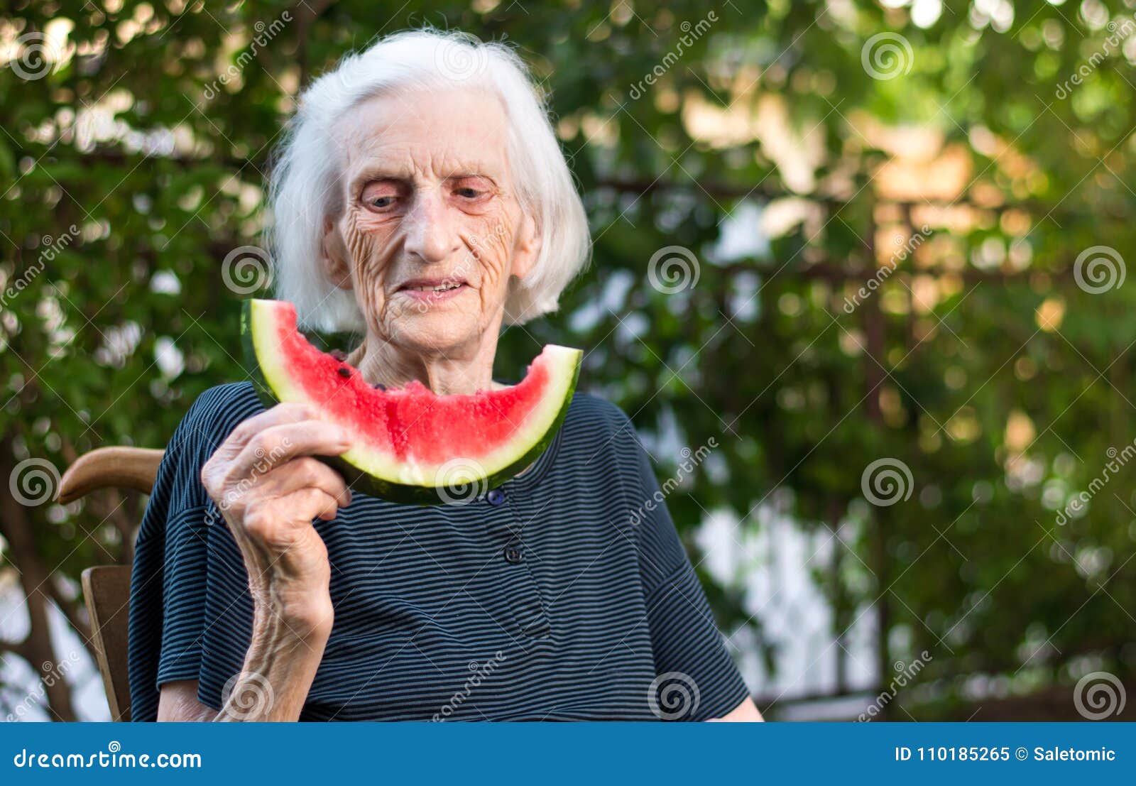 Senior Woman Eating Watermelon Outdoors Stock Image - Image of ...
