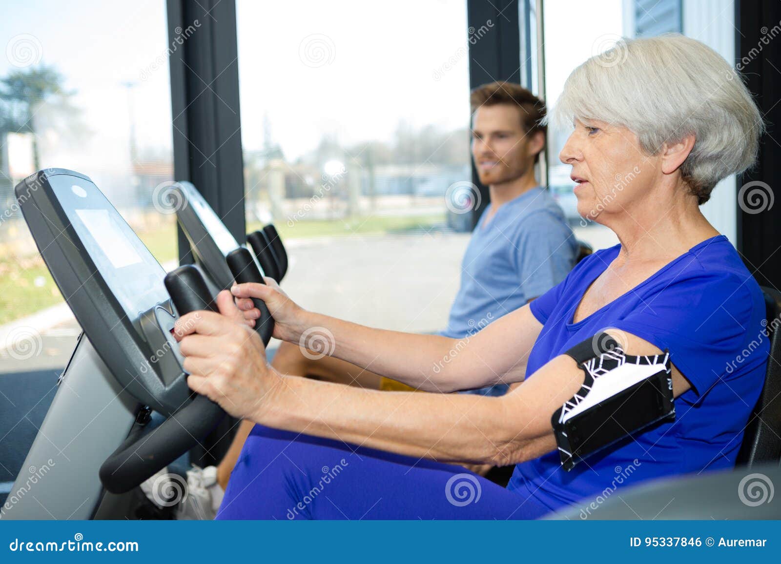 Senior Woman on Exercise Machine Stock Photo - Image of loss ...