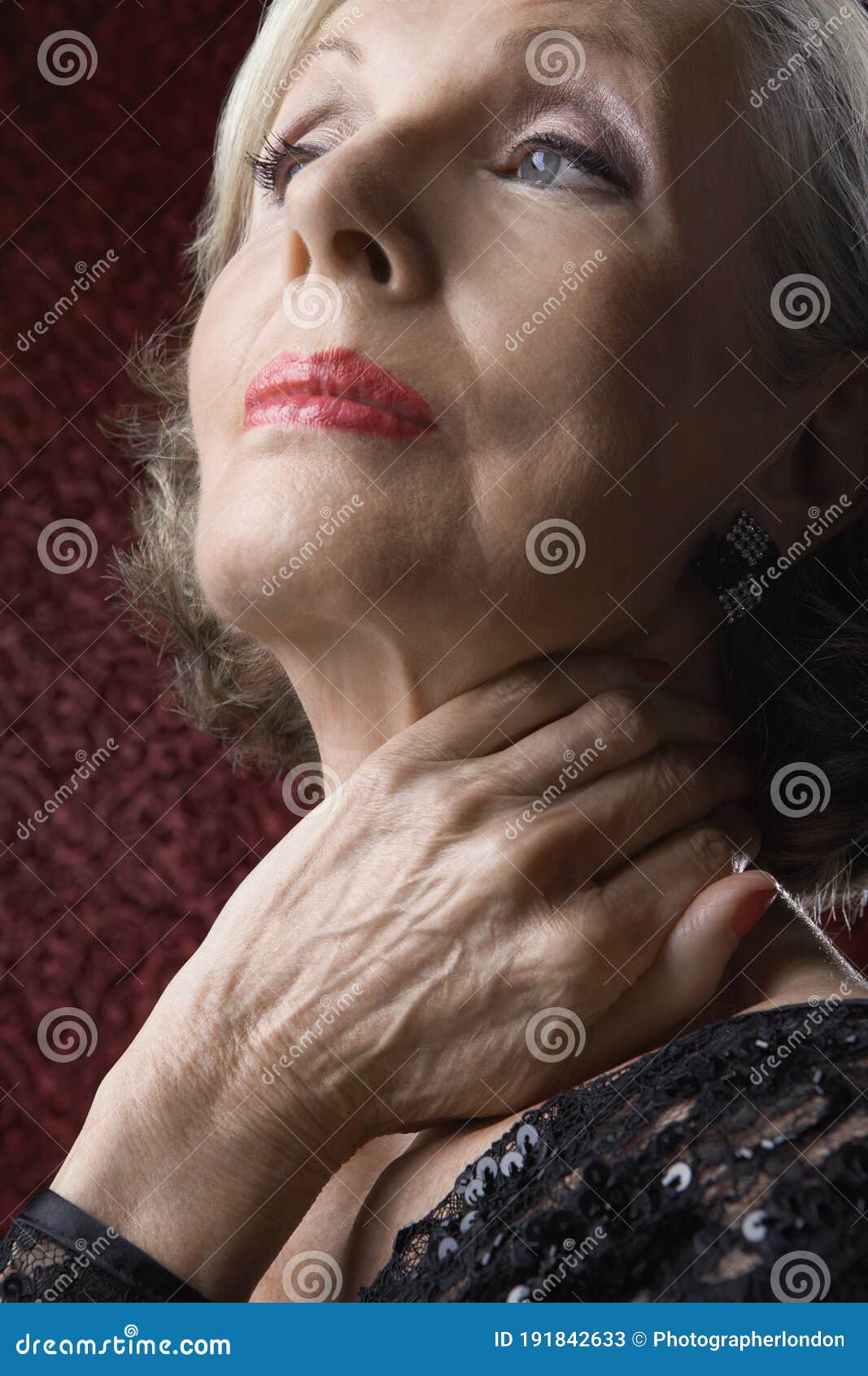Senior Woman with Hand on Neck Stock Image - Image of haired, black ...