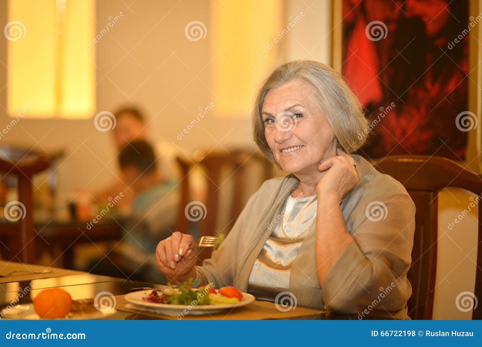 Senior woman having dinner stock photo. Image of lady - 66722198