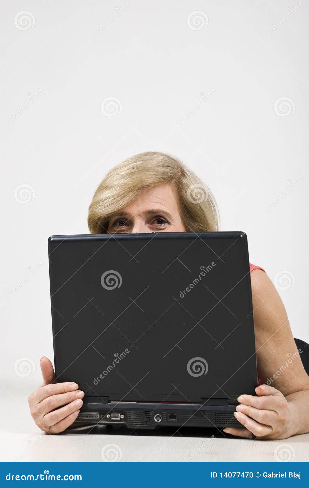 Senior Woman Hiding Behind Laptop Stock Photo - Image of mature, look ...