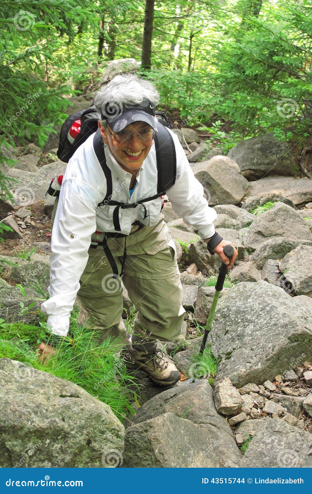 Senior Woman Hiking on Rocks Stock Photo - Image of foliage, rocks ...