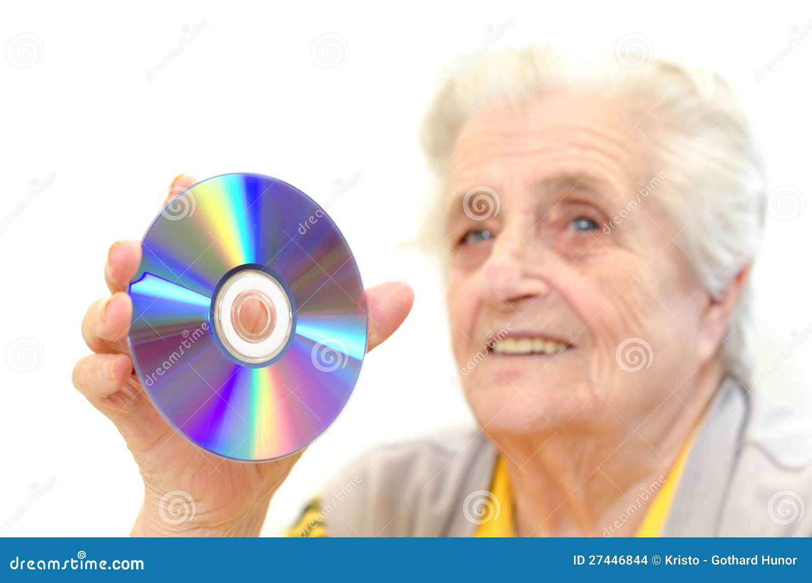 Senior woman holding dvd stock photo. Image of elderly - 27446844