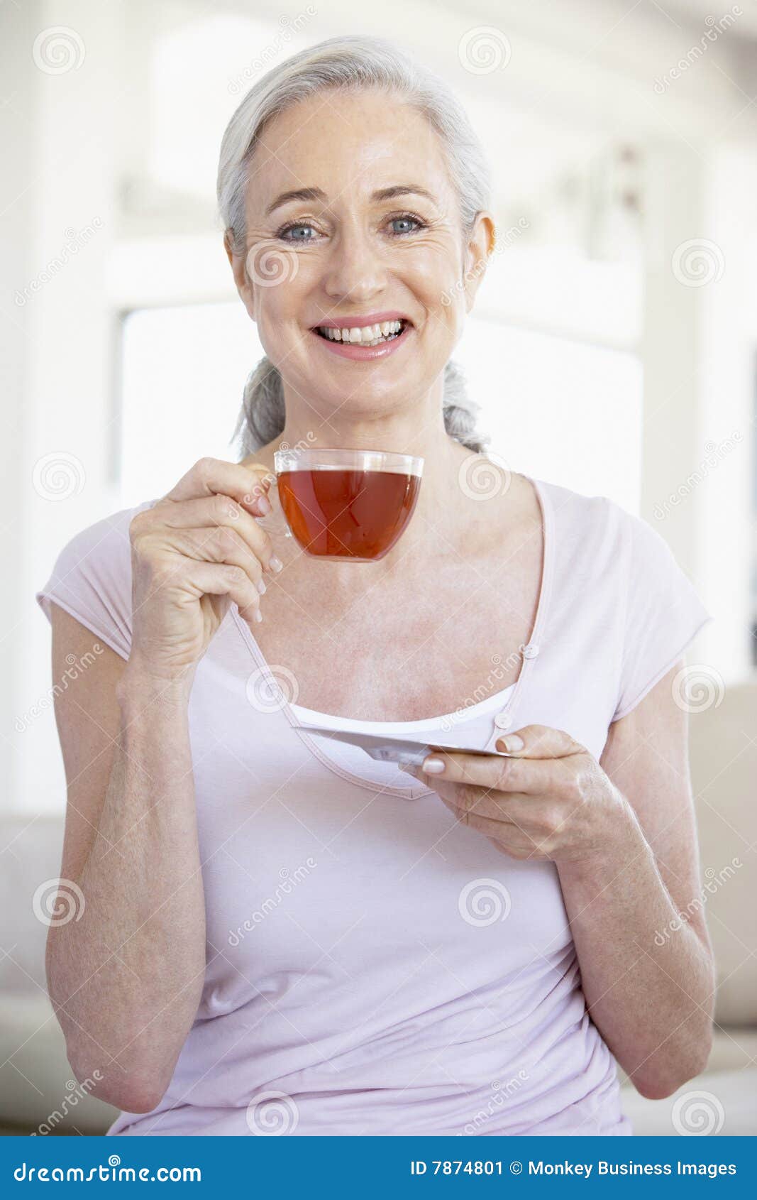 Senior Woman Holding Tea and Smiling at the Camera Stock Image - Image ...