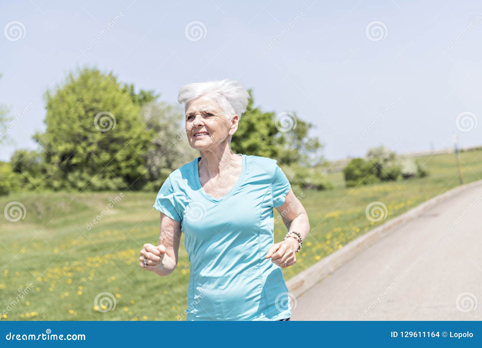 Senior Woman Jogging in Park Stock Photo - Image of enjoying, people ...