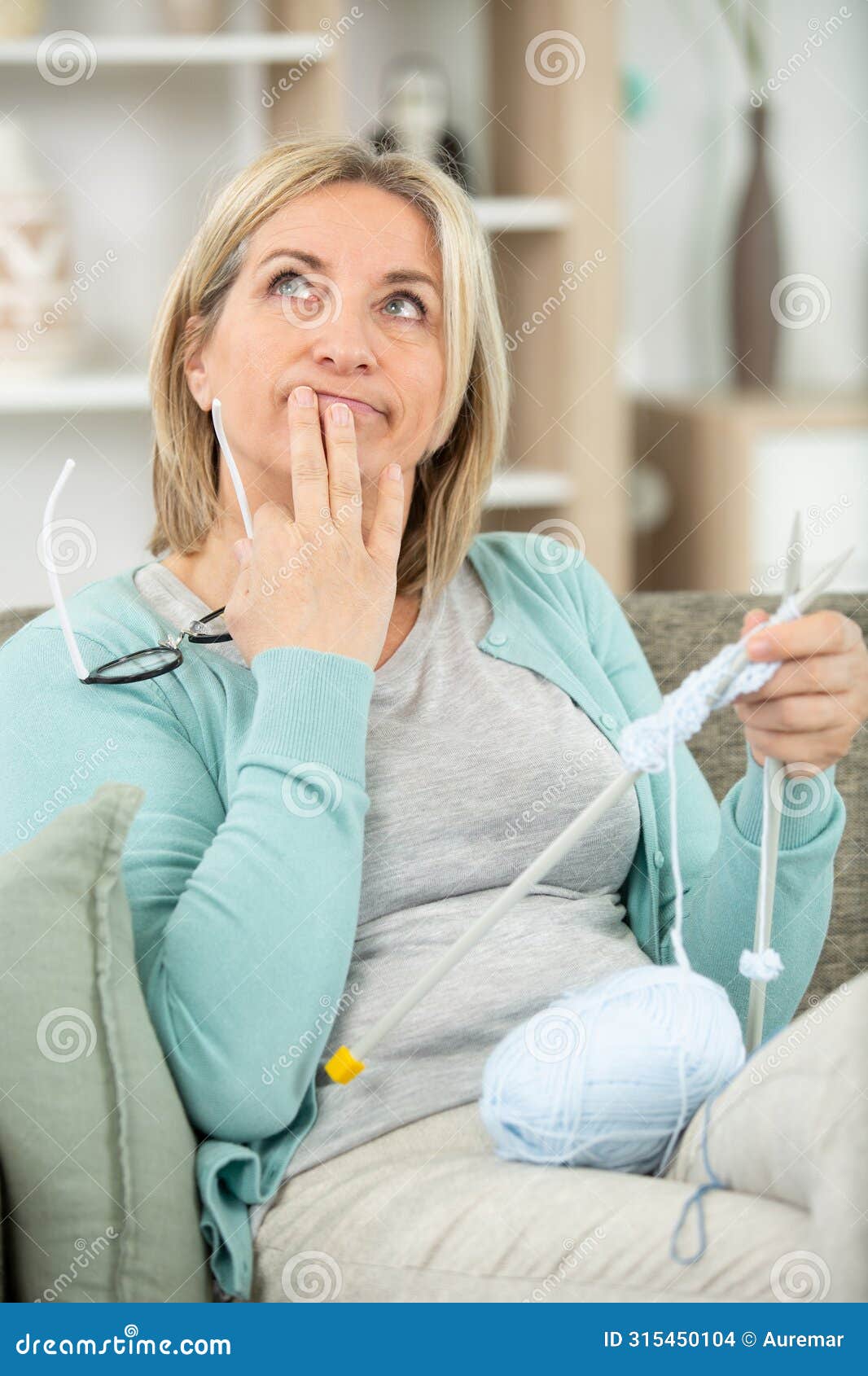 Senior Woman Knitting on Sofa at Home Stock Photo - Image of relaxation ...
