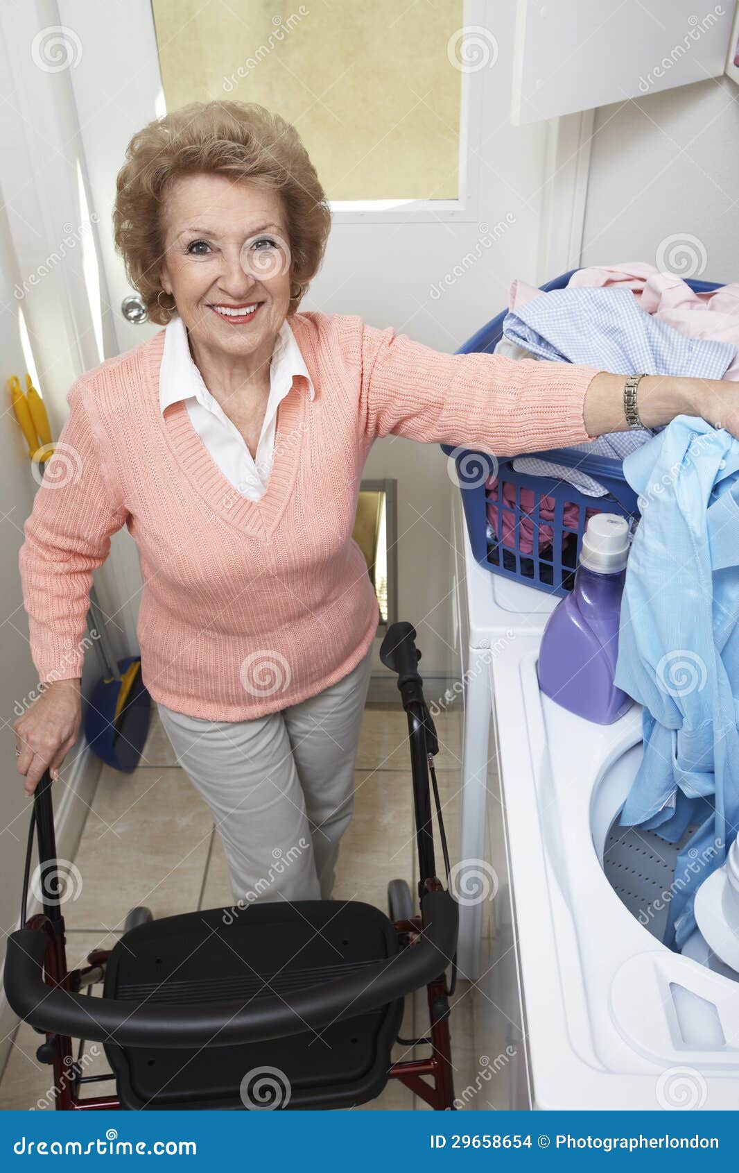 Senior Woman with Laundry by Washing Machine Stock Photo - Image of ...