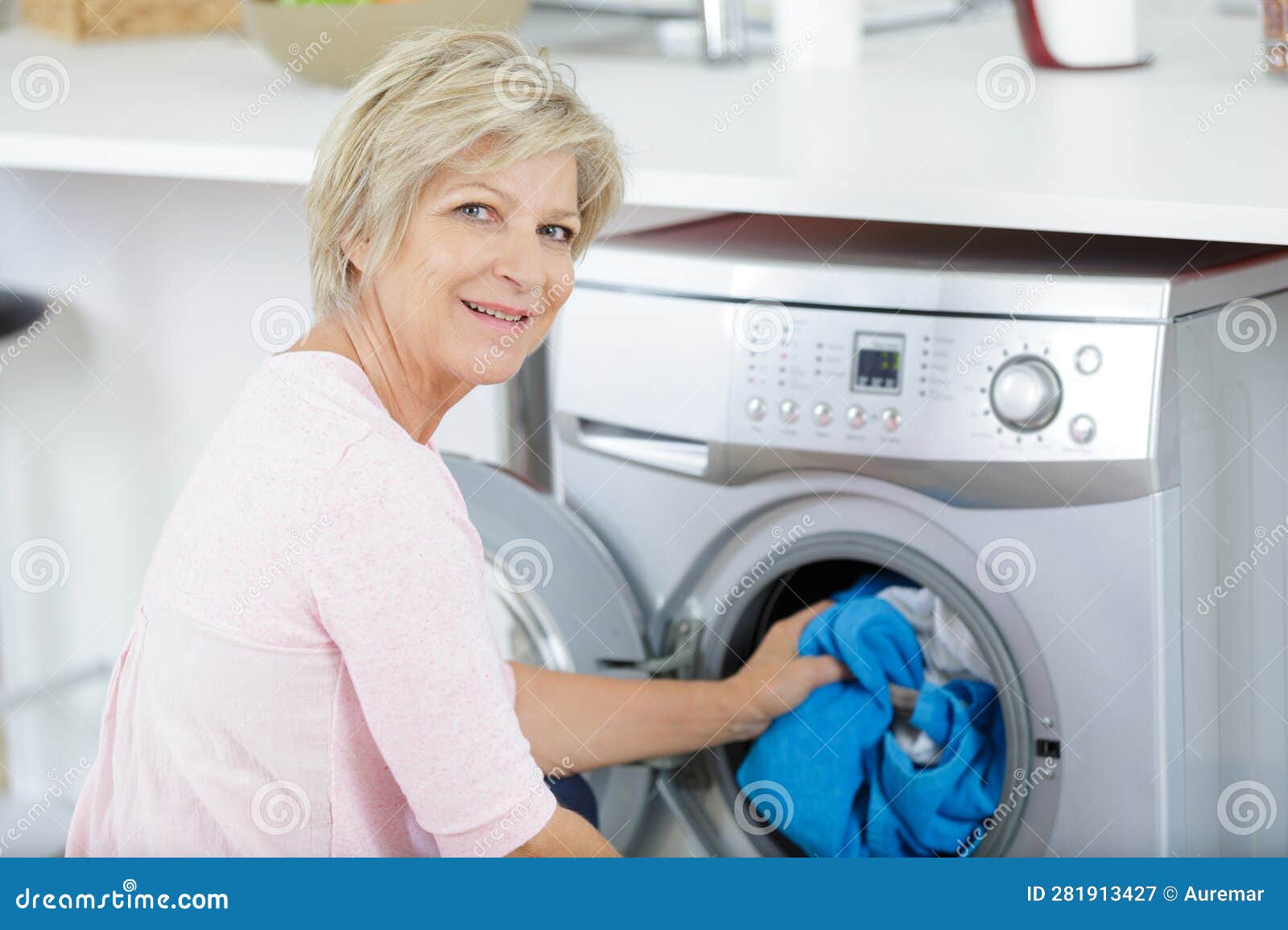 Senior Woman Loading Washing Machine at Home Stock Image - Image of ...