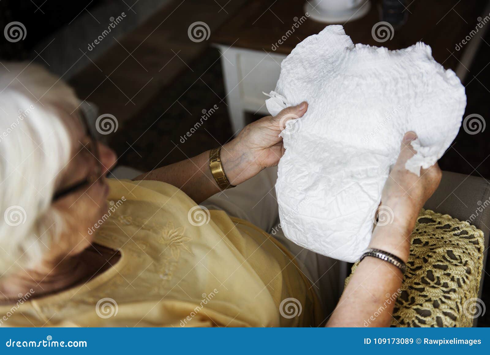 Senior Woman Looking at a Diaper Stock Image - Image of house, alone ...