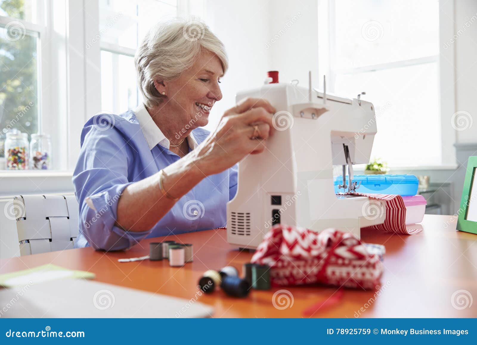Senior Woman Making Clothes Using Sewing Machine at Home Stock Image ...
