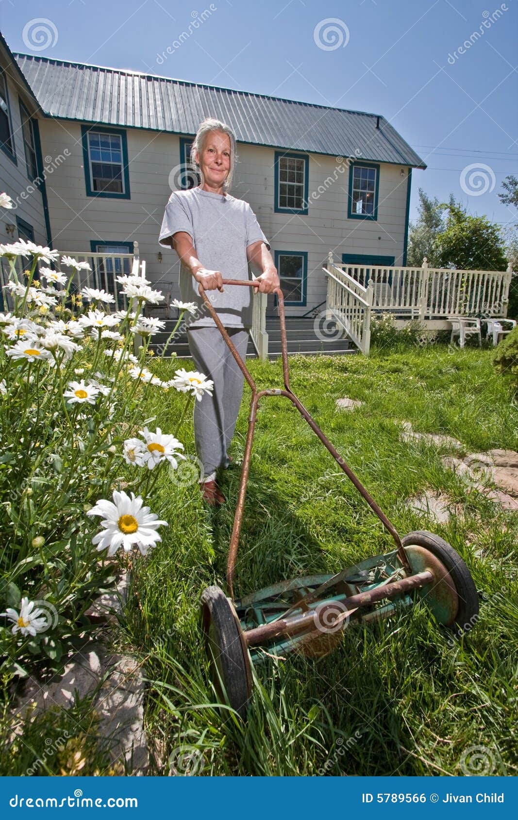 Senior woman mowing lawn stock photo. Image of mowing - 5789566