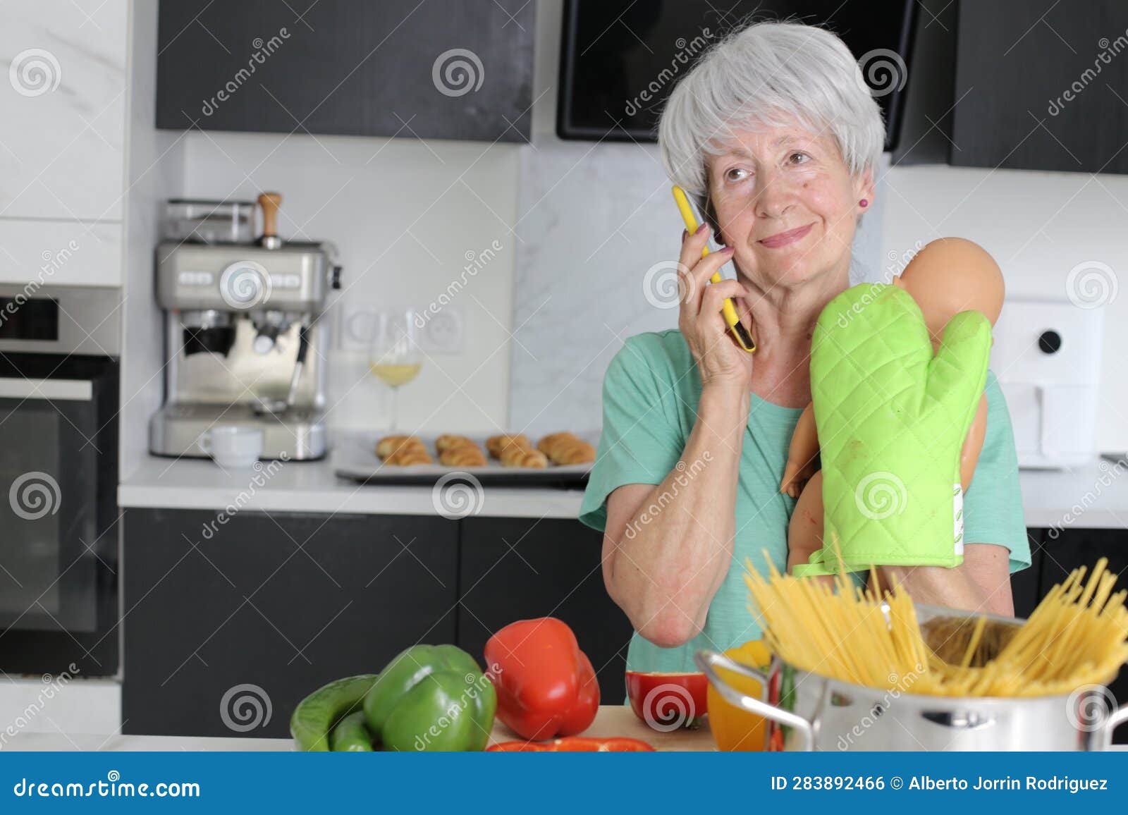 Senior Woman Multitasking in the Kitchen Stock Photo - Image of calling ...