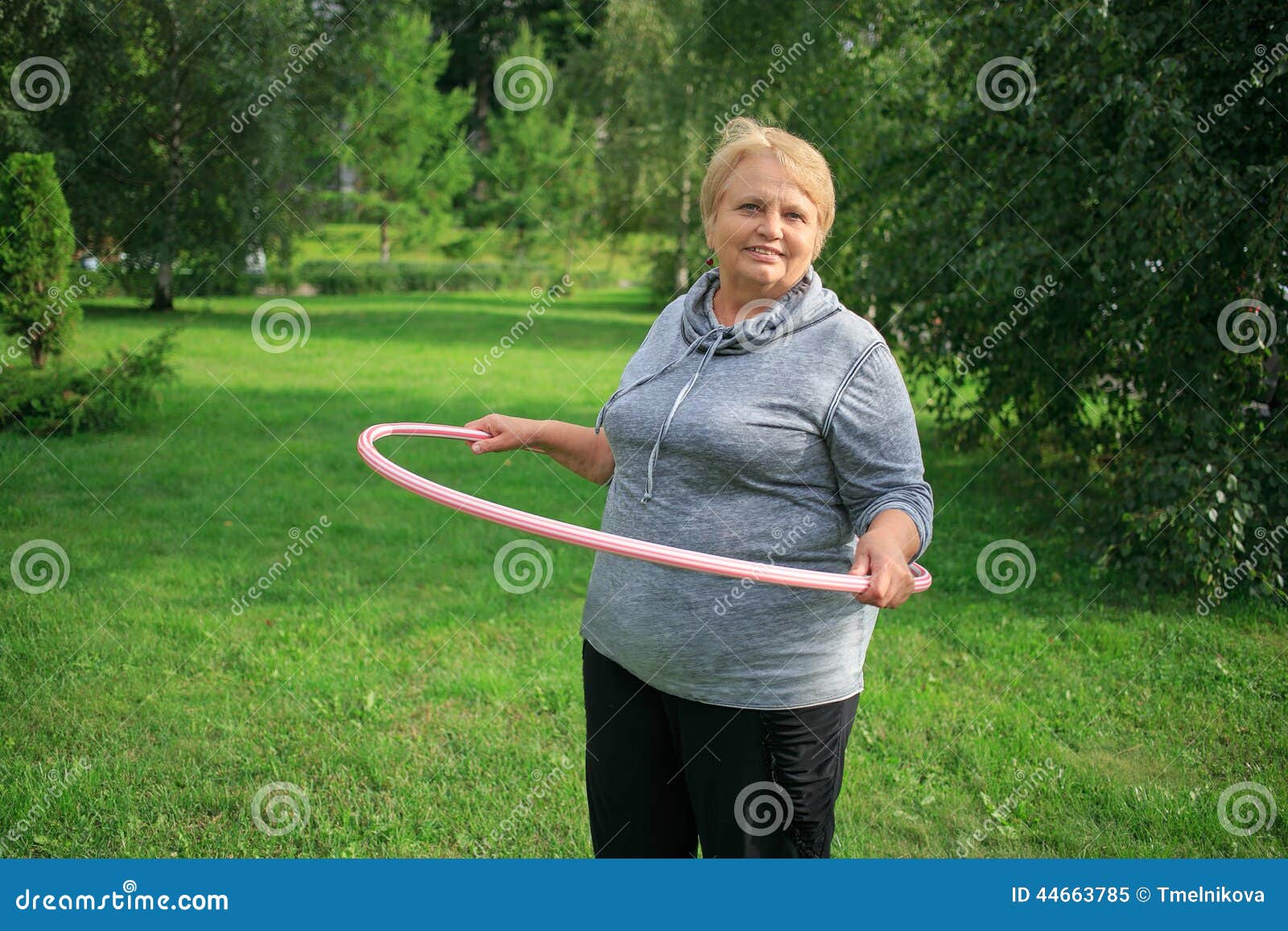 Senior Woman Playing with Her Hoop Stock Image - Image of park, retired ...