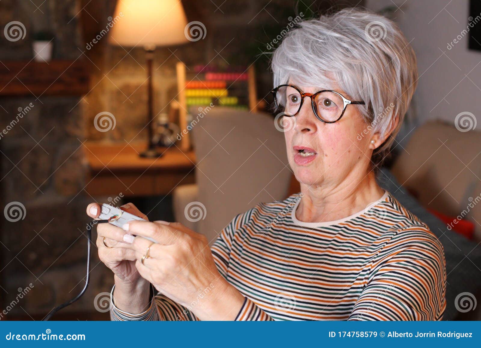 Senior Woman Playing Video Games Stock Image - Image of amazed, gamer ...