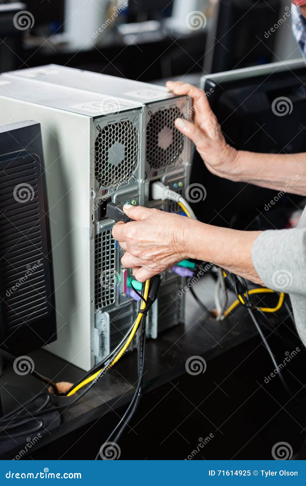 Senior Woman Plugging Computer in Classroom Stock Image - Image of hand ...