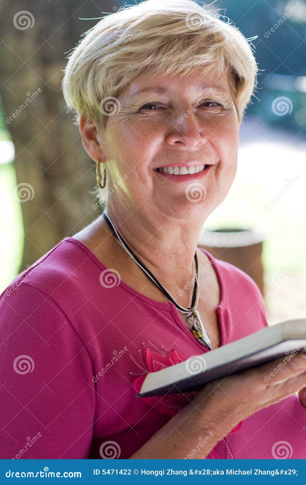 Senior woman reading book stock photo. Image of blond - 5471422