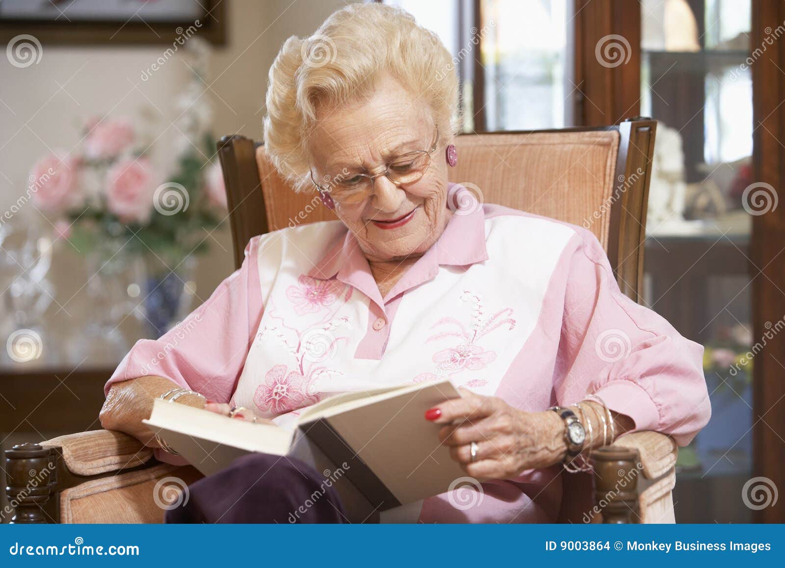 Senior woman reading book stock photo. Image of female - 9003864