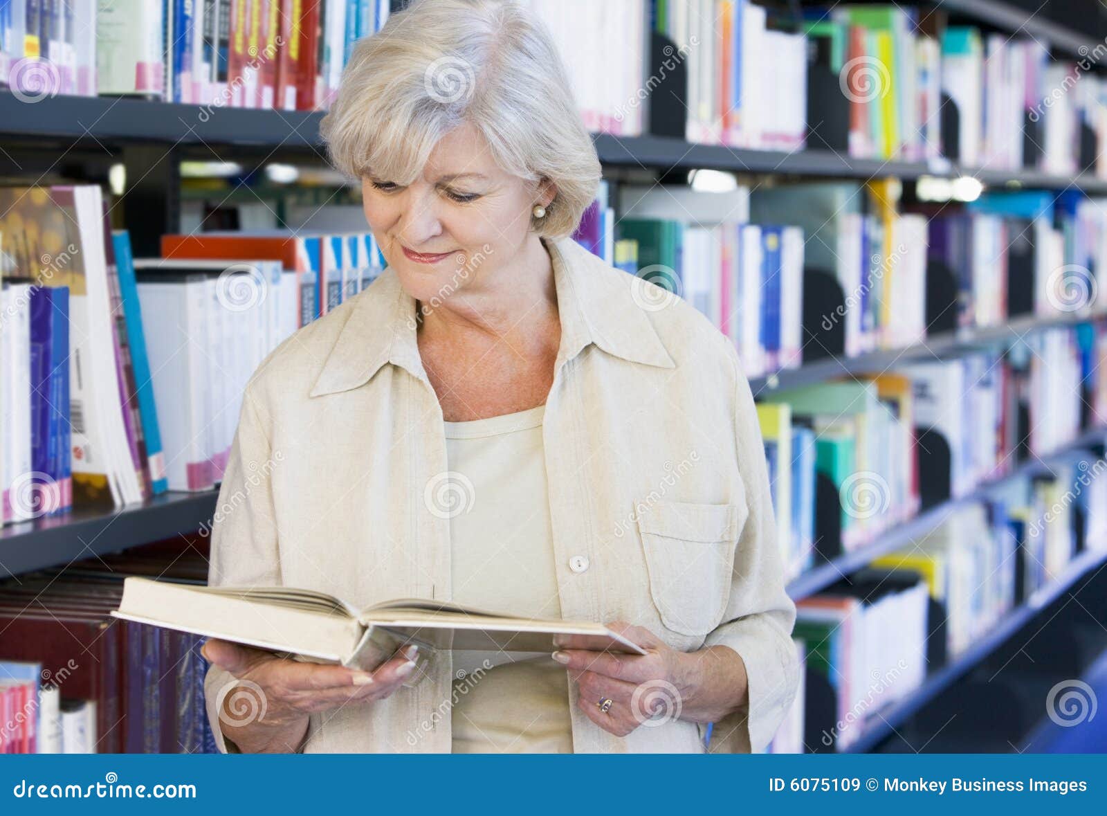 Senior Woman Reading in a Library Stock Image - Image of female, senior ...
