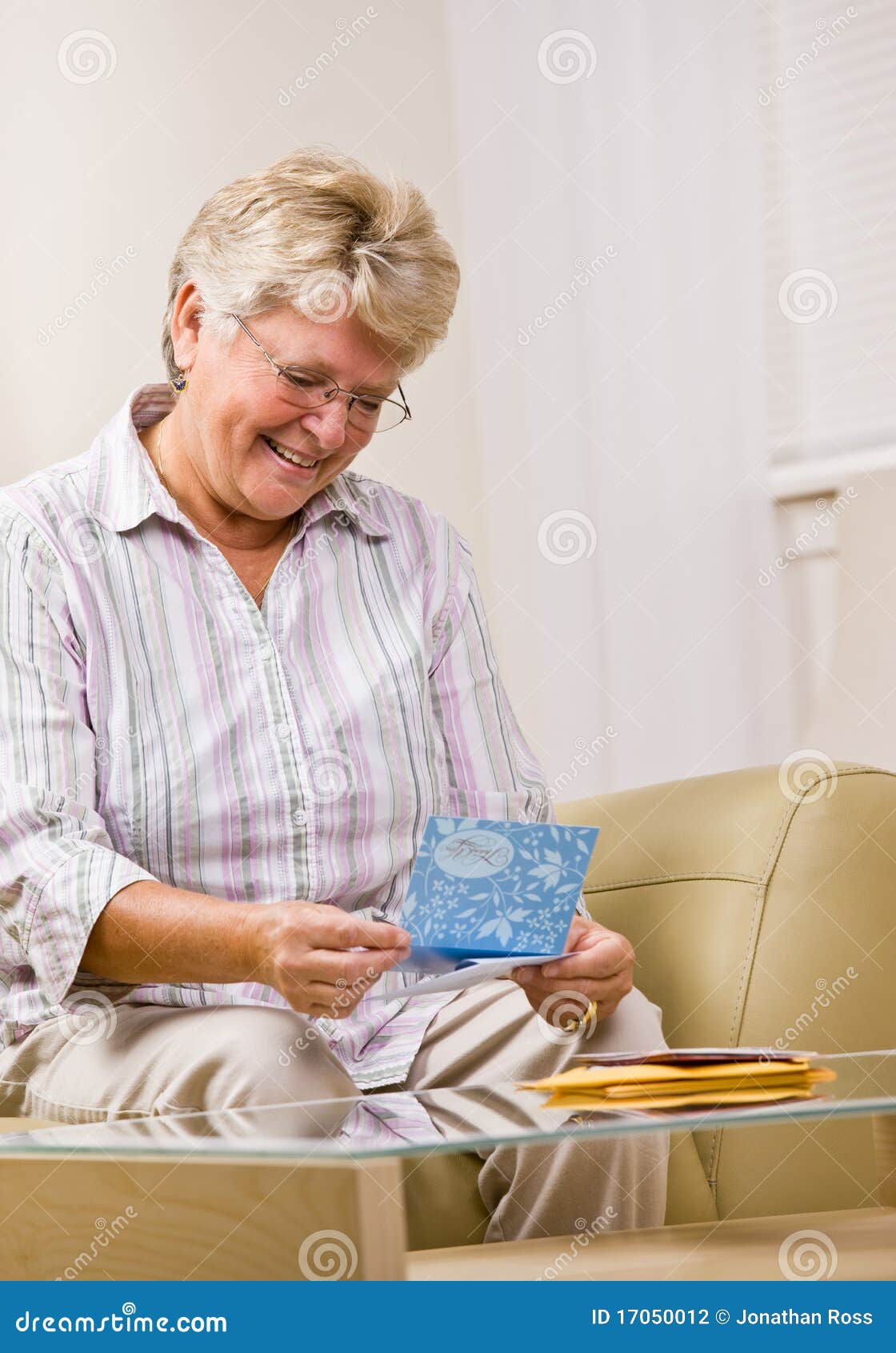 Senior Woman Reading Note Card Stock Photo - Image of retirement ...