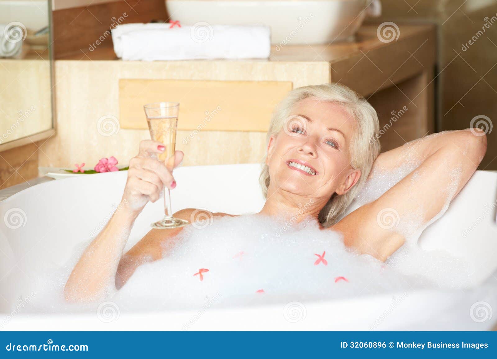 Senior Woman Relaxing in Bath Drinking Champagne Stock Photo - Image of ...