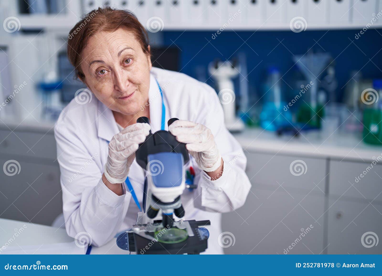 Senior Woman Scientist Smiling Confident Using Microscope at Laboratory ...