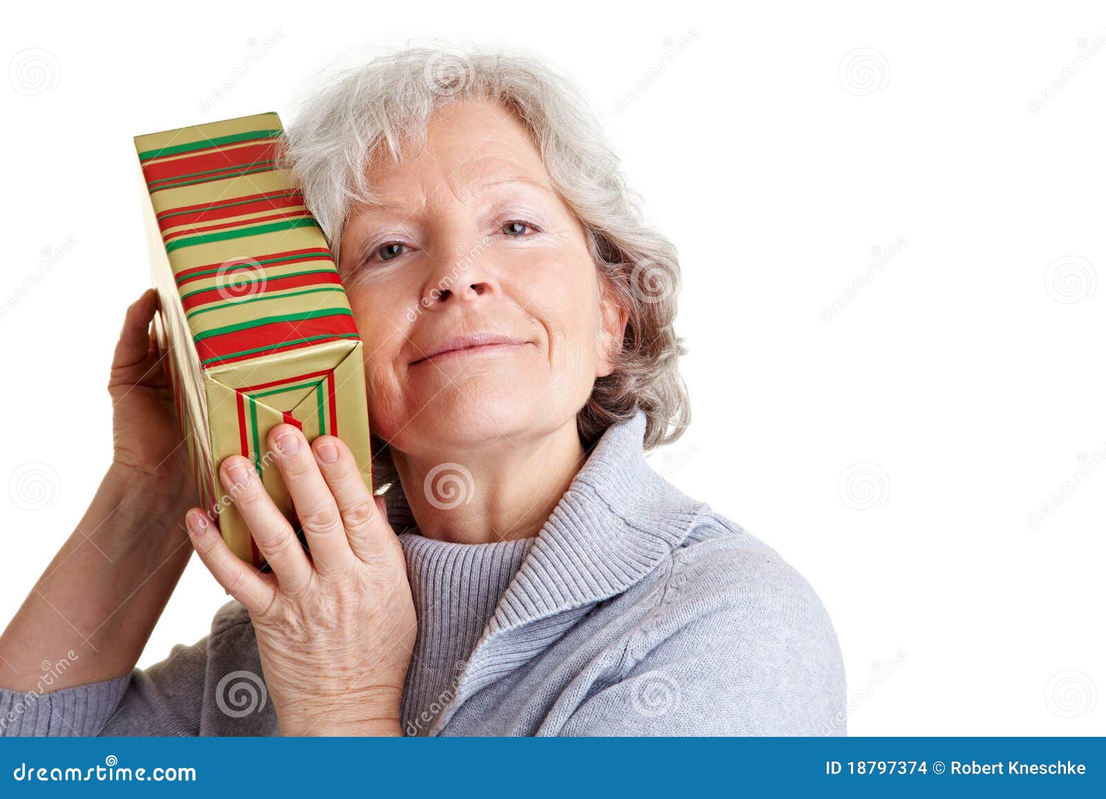 Senior Woman Shaking a Gift Stock Photo - Image of person, carry: 18797374