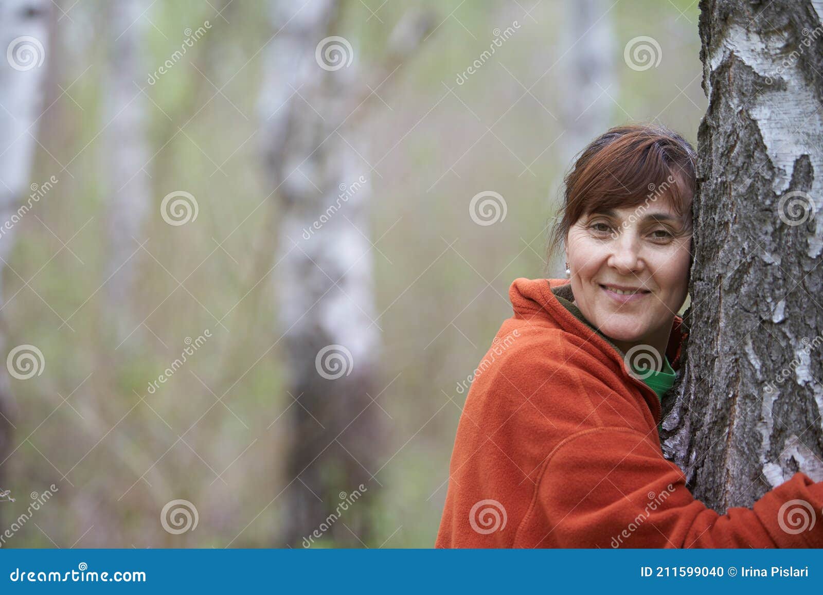 Senior Woman Smiling and Hugging a Birch Tree. Stock Photo - Image of ...