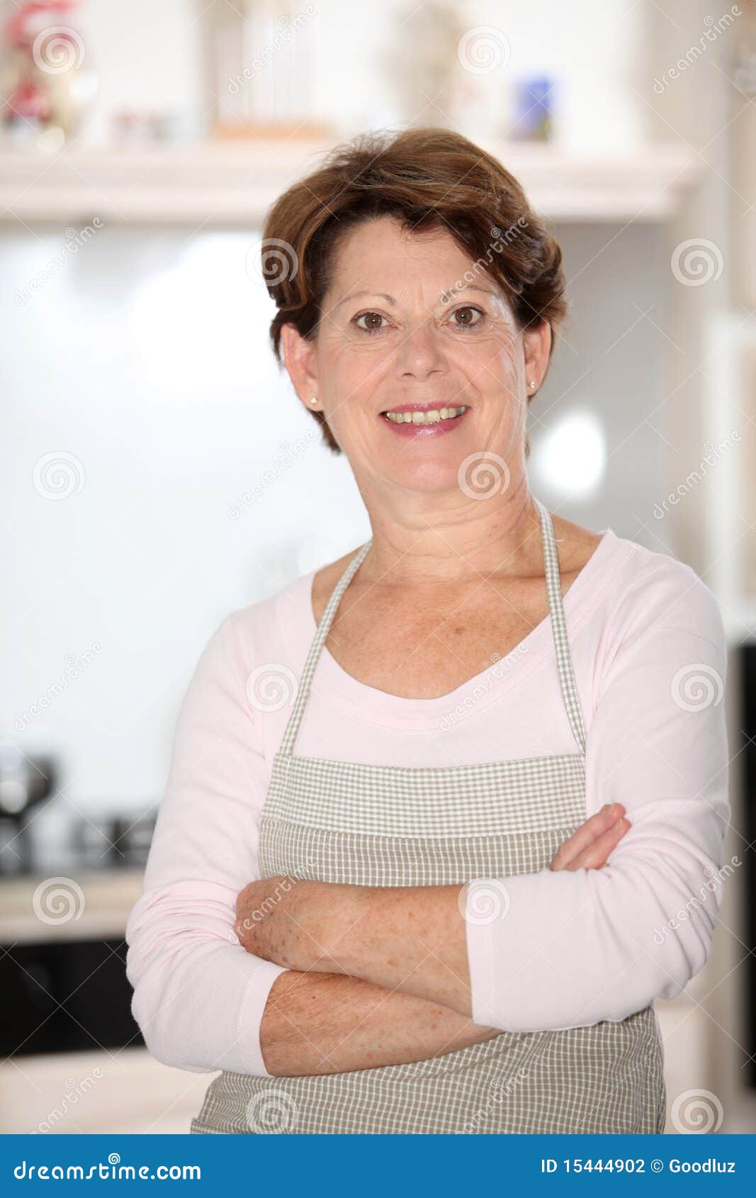Senior Woman Standing in Kitchen Stock Photo - Image of happy, indoors ...