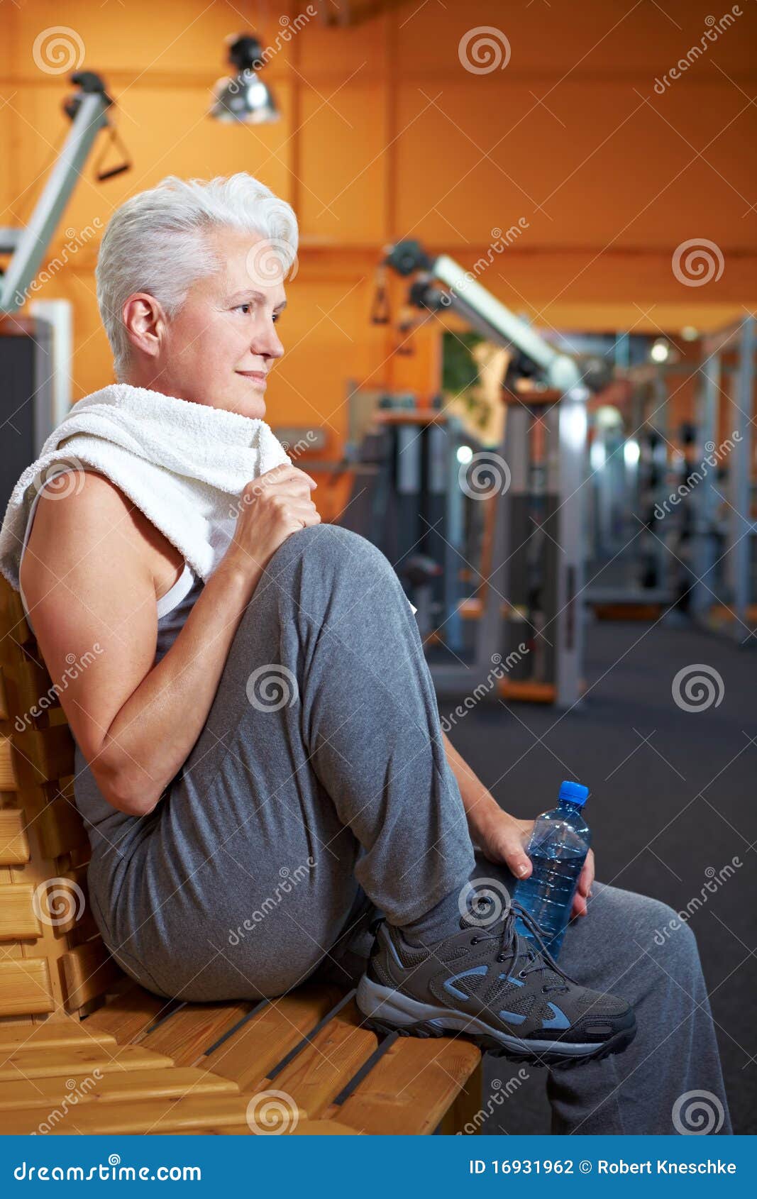 Senior Woman Taking Break in Gym Stock Photo - Image of health ...