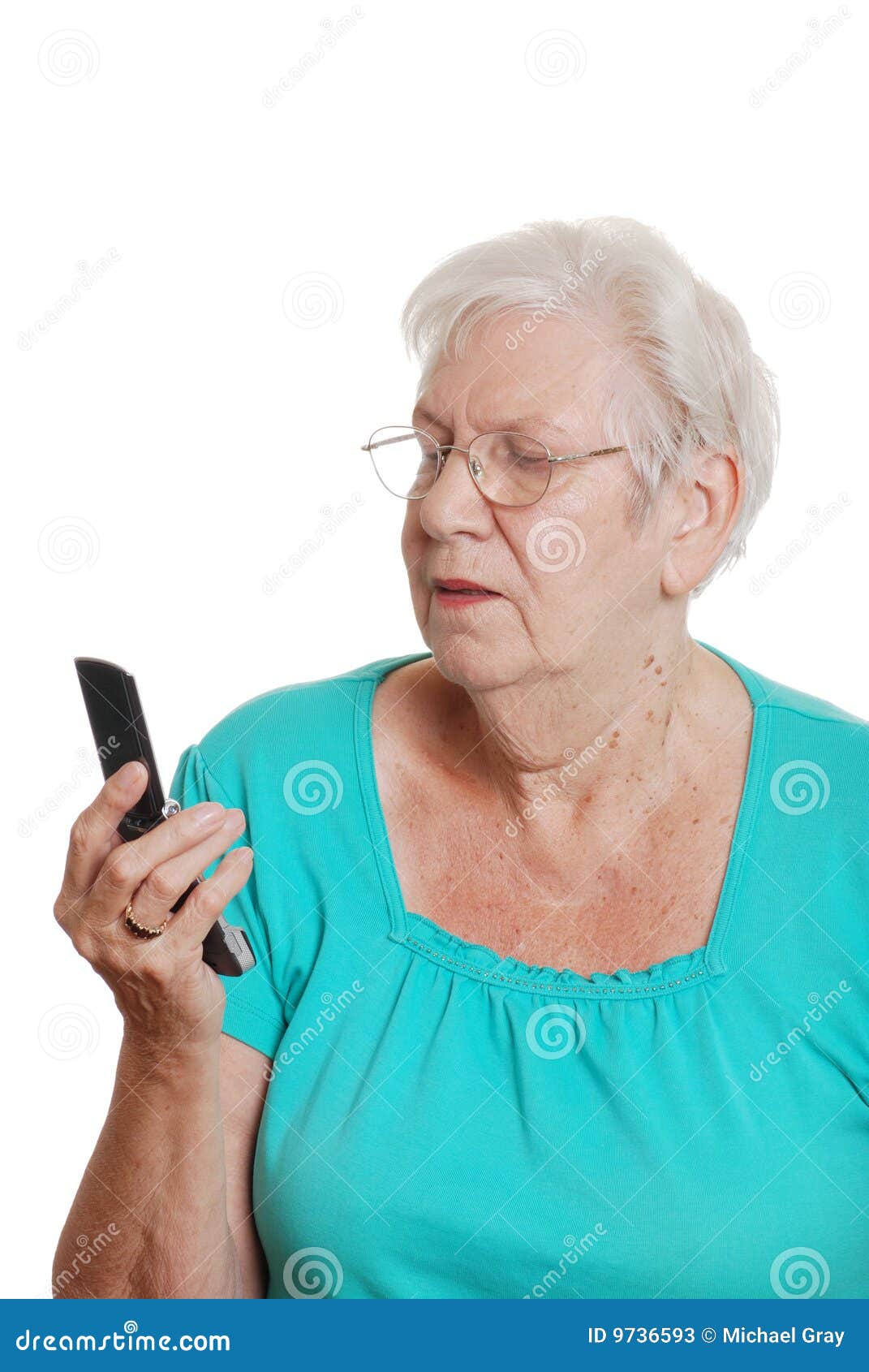 Senior Woman Trying To Use a Cell Phone Stock Image - Image of ...
