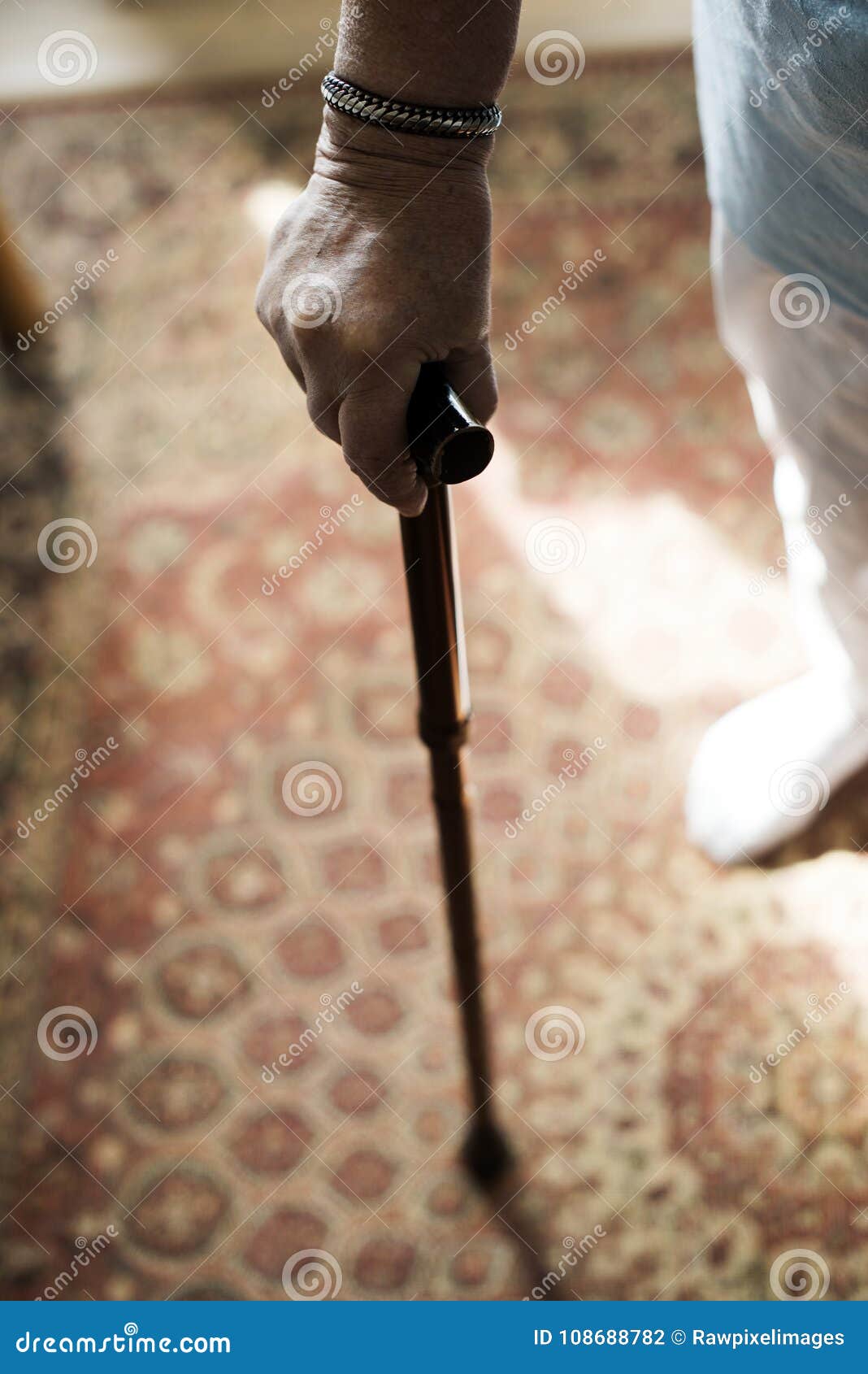 Senior woman using a cane stock photo. Image of residence - 108688782